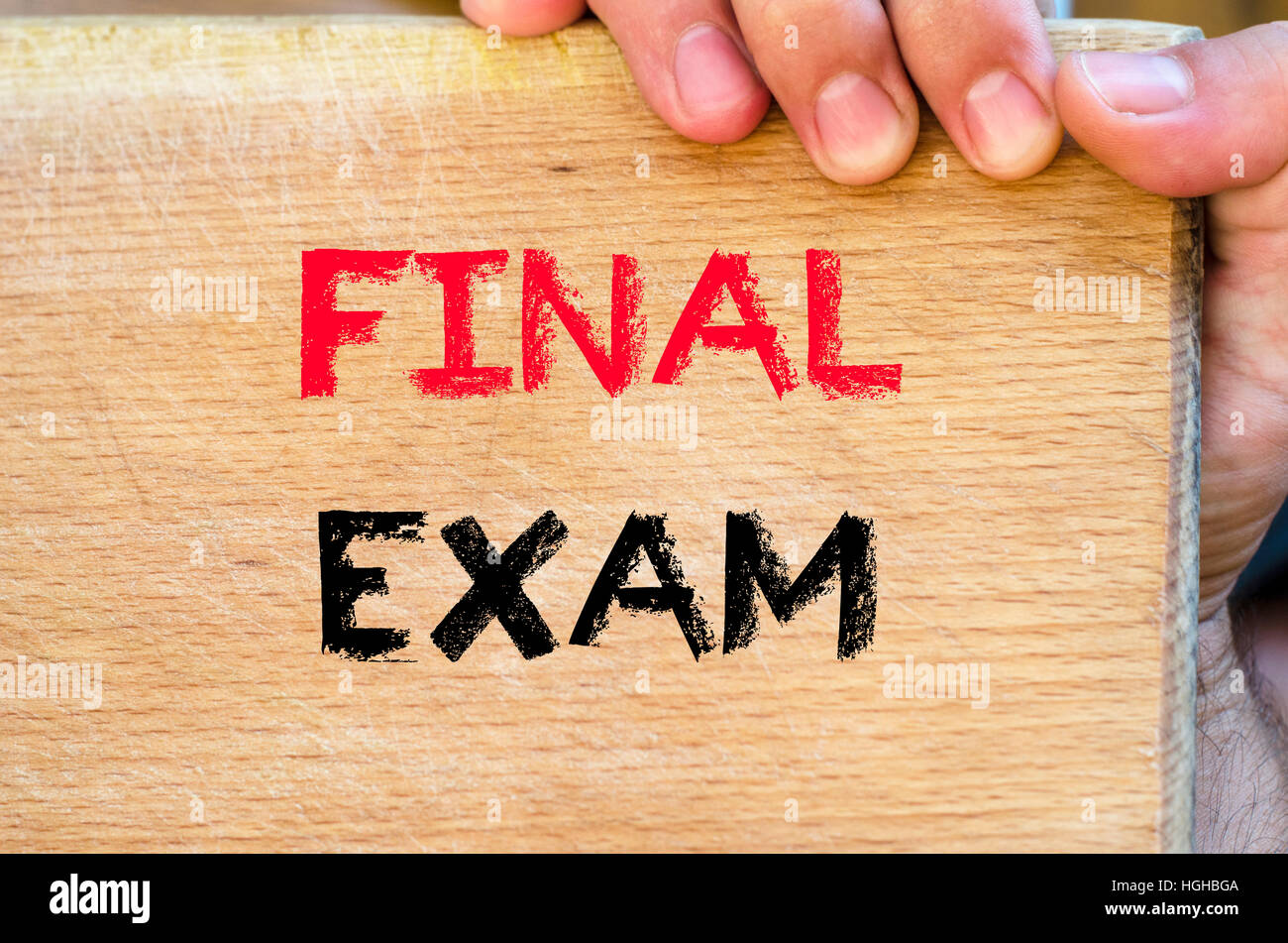 Human hand over wooden background and final exam text concept Stock ...
