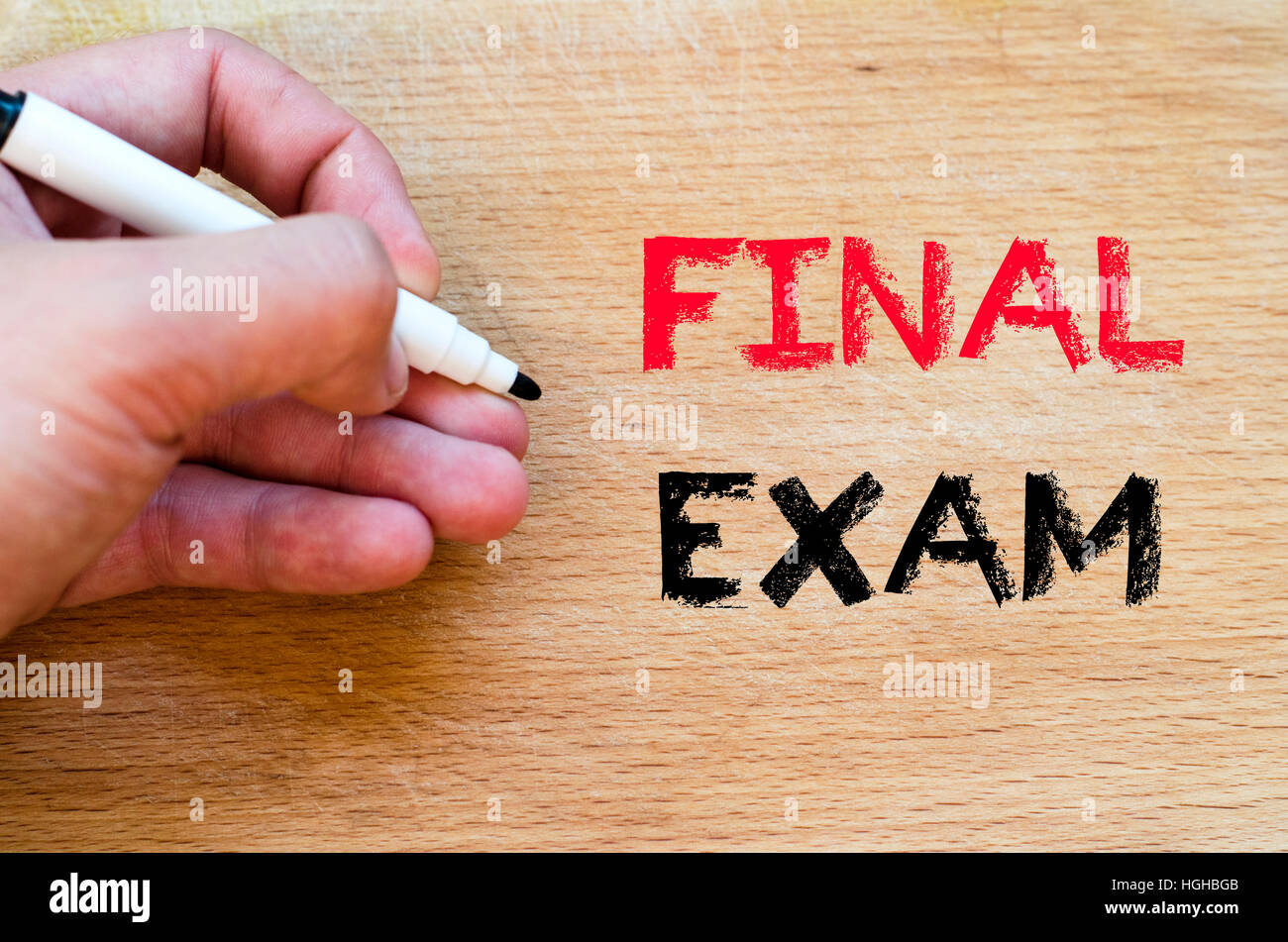 Human hand over wooden background and final exam text concept Stock ...