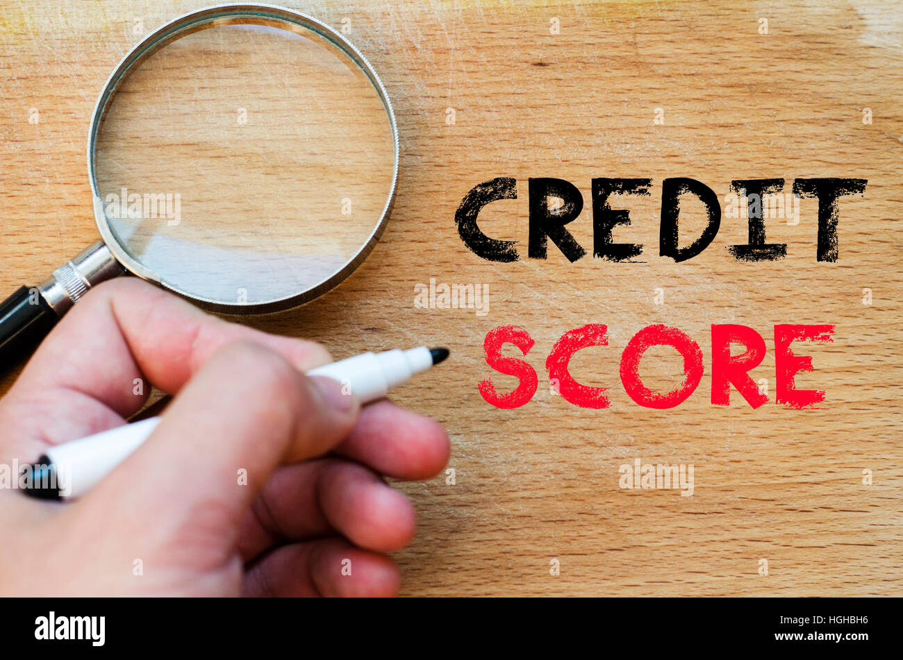 Human hand over wooden background and credit score text concept Stock ...