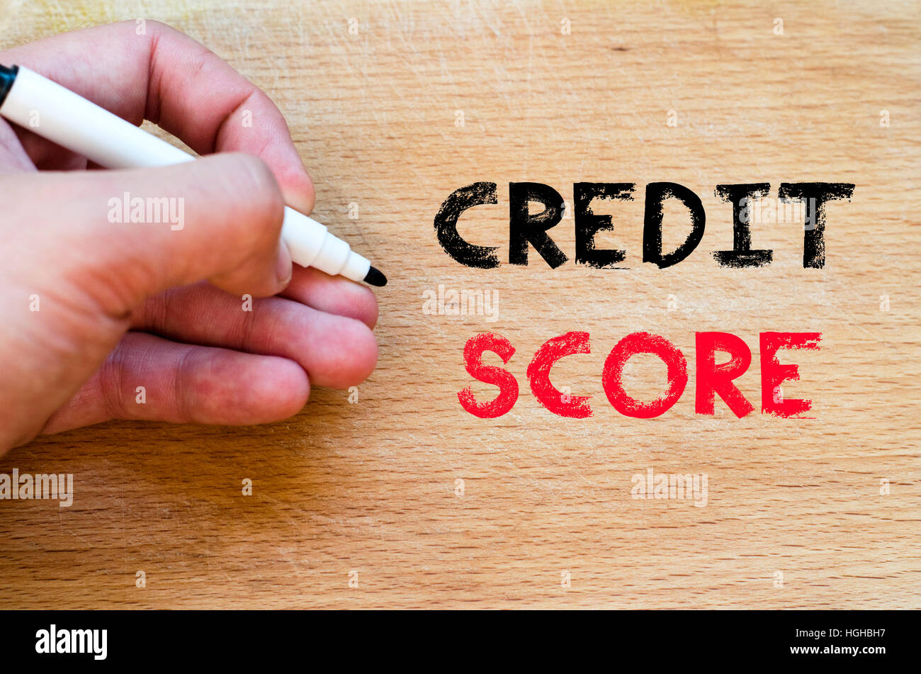 Human hand over wooden background and credit score text concept Stock ...