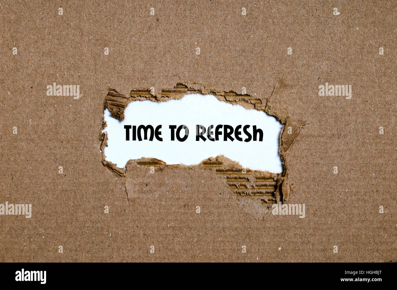 The word time to refresh appearing behind torn paper Stock Photo - Alamy