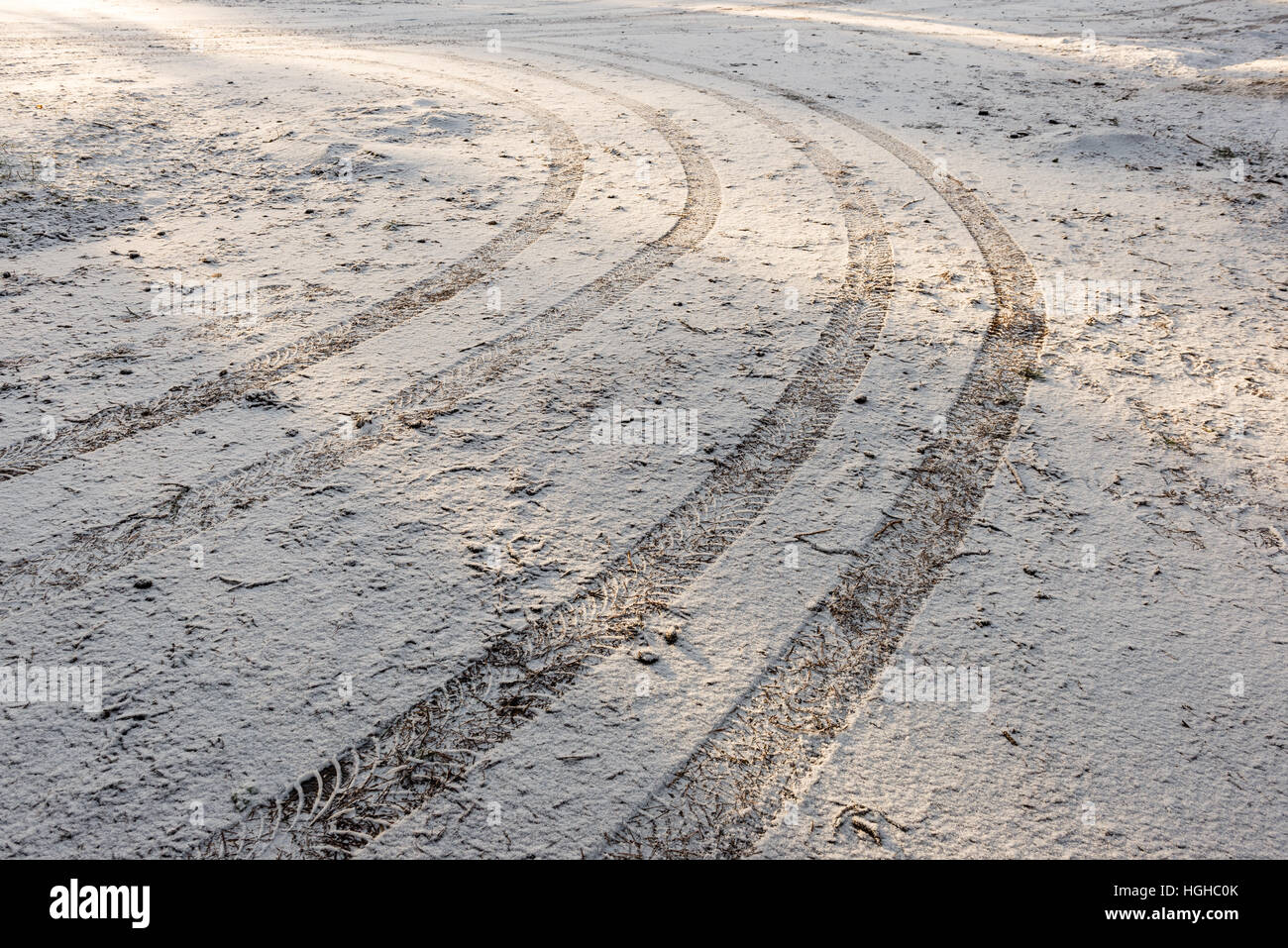 car tire tracks on winter road in deep snow in lonely forest Stock ...