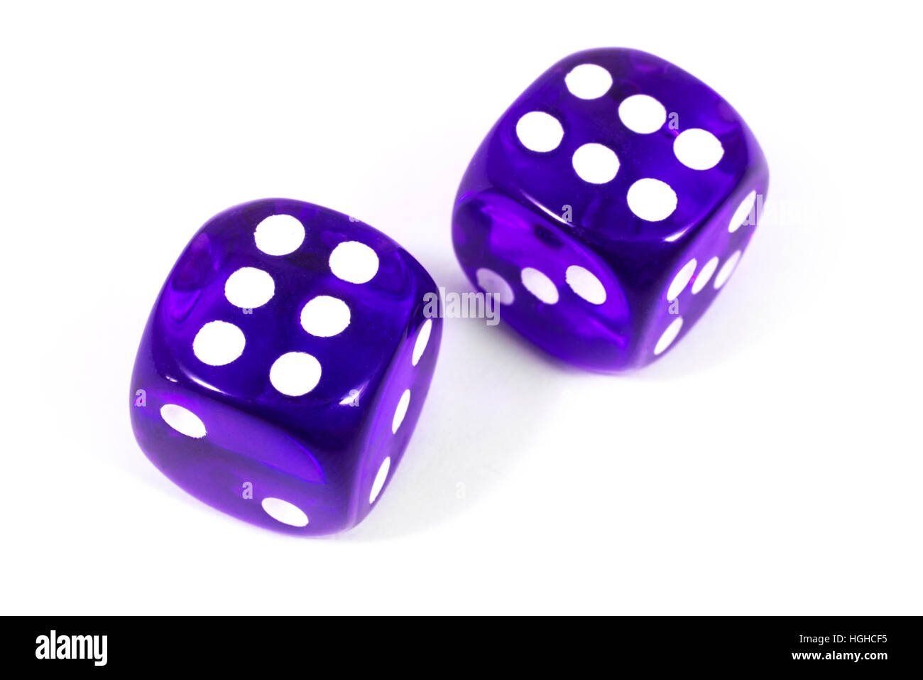 Two purple dice over a plain white background Stock Photo - Alamy