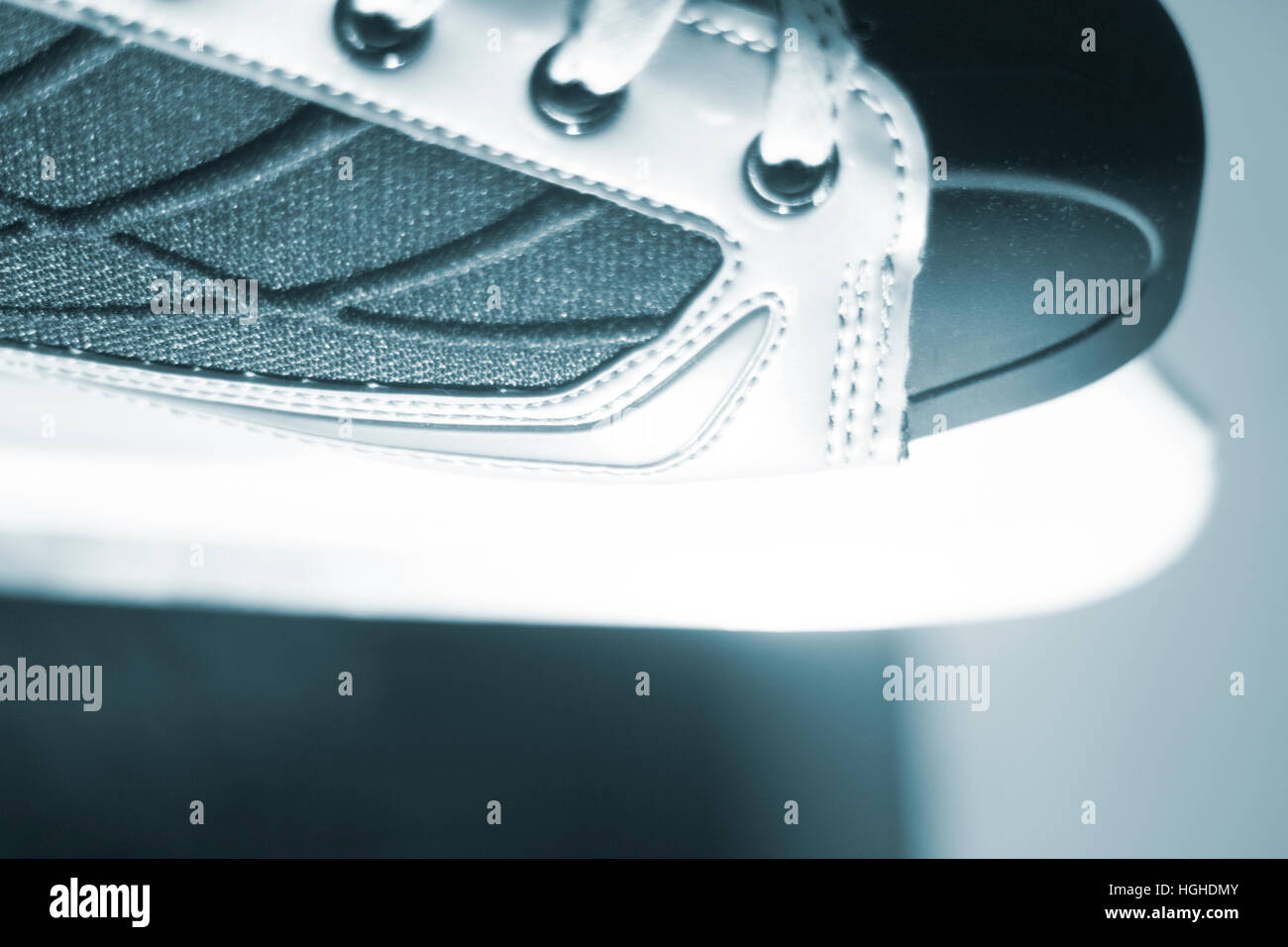 Ice skates in skate store shop window on display on sale for skating on ...