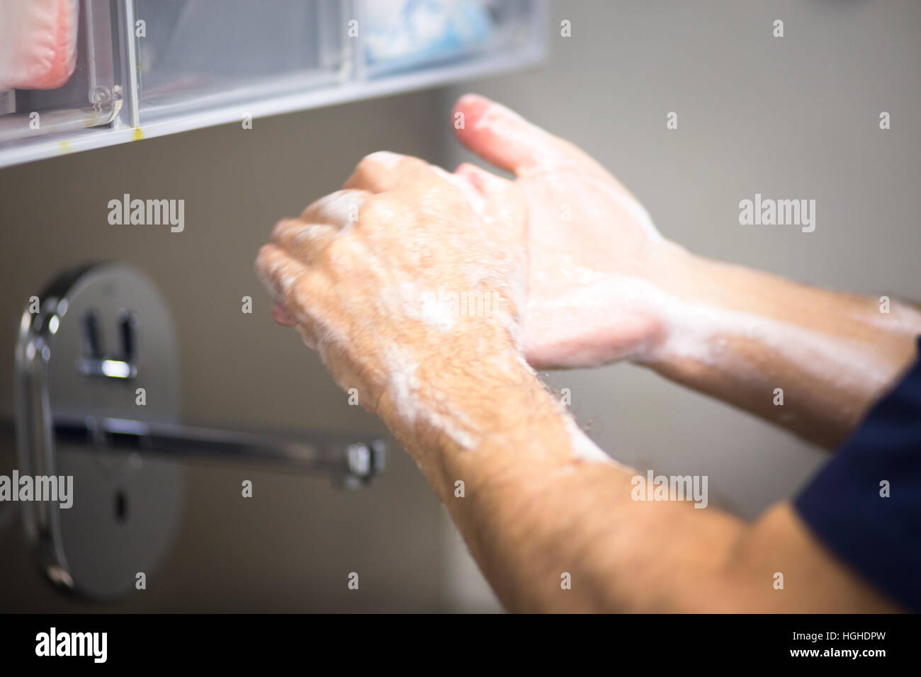 Surgeon in hospital surgery washing handsin sterile uniform "scrubs ...