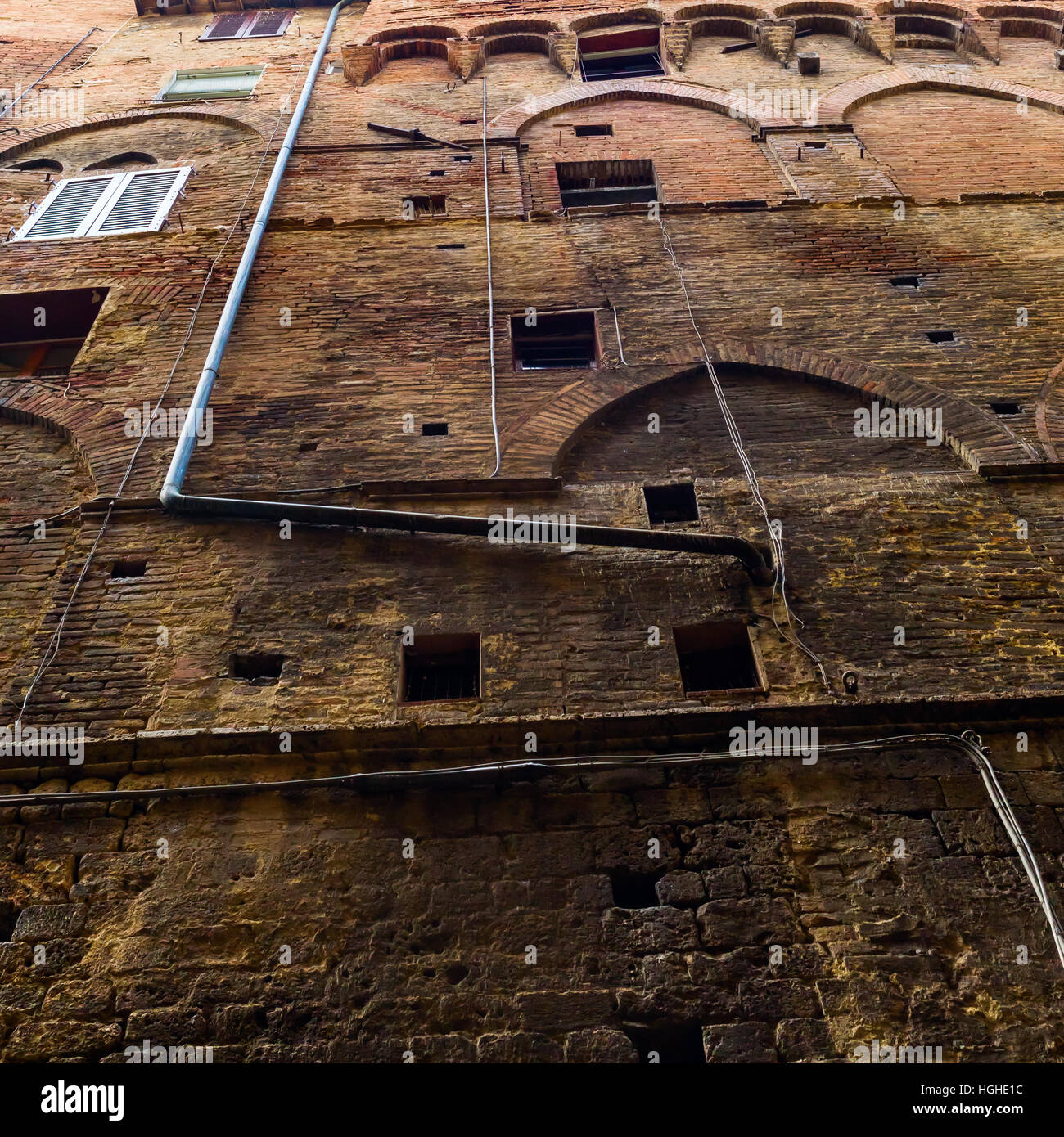 typical medieval house facade in Siena, Tuscany, Italy Stock Photo - Alamy