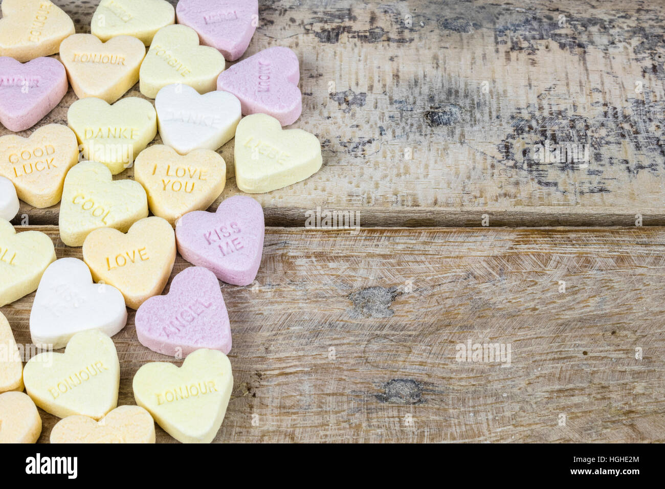 Group of sweet candies with heart shape on a wooden table Stock Photo ...