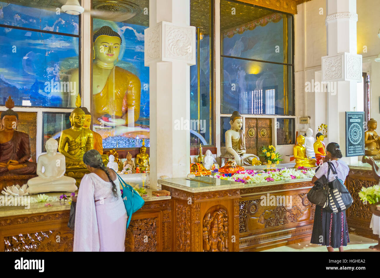 The Buddhist pilgrims pray in Image House of Bodhi Tree Temple Stock ...