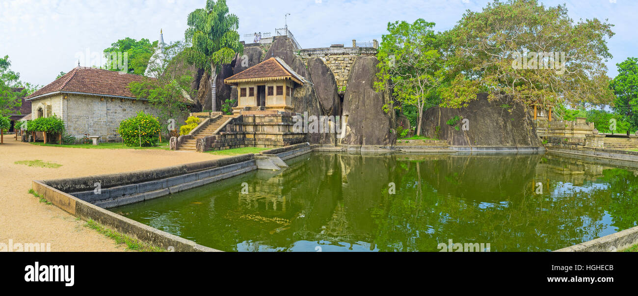 The scenic pond of Isurumuniya Viharaya (Monastery), with the giant ...