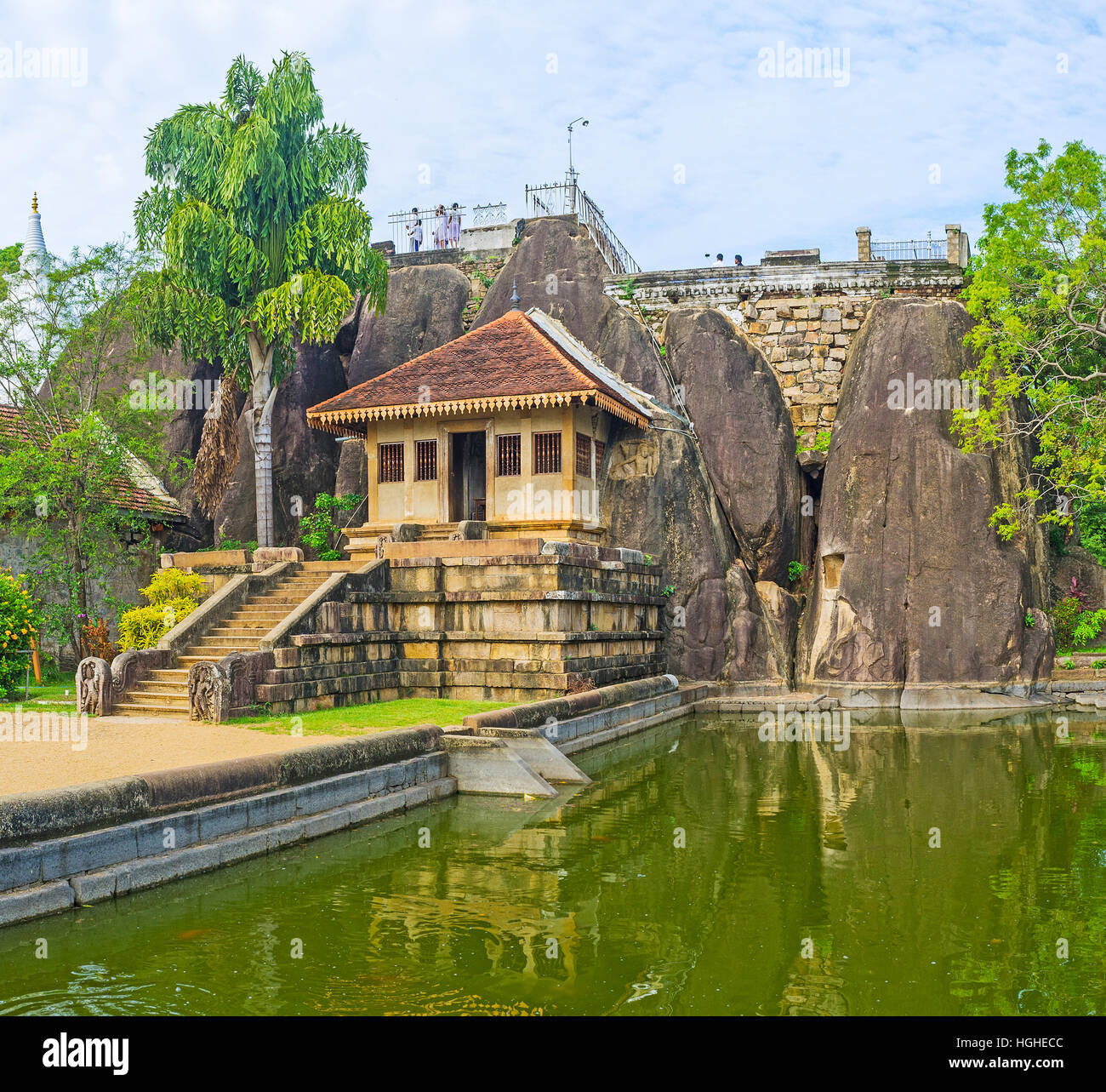 The Isurumuniya Rock Temple located at the bank of the pond, the rock ...