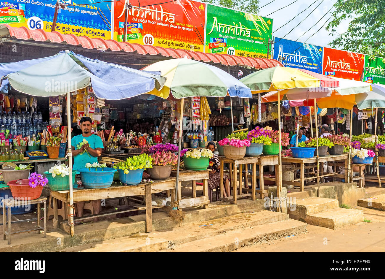 The market stalls at Ruwanwelisaya Stupa with bright lotus flowers ...