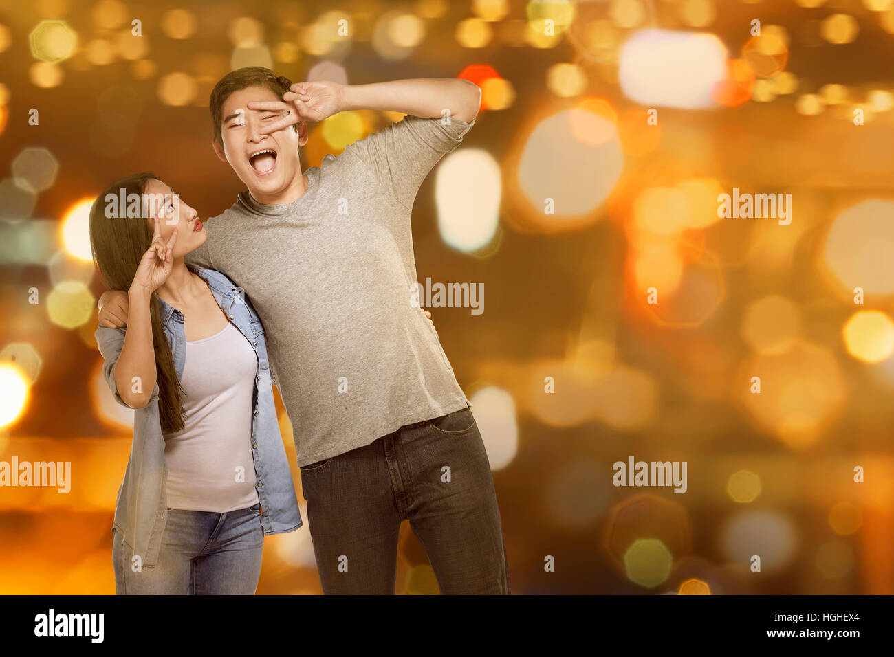 Funny cheerful asian couple man hi-res stock photography and images - Alamy