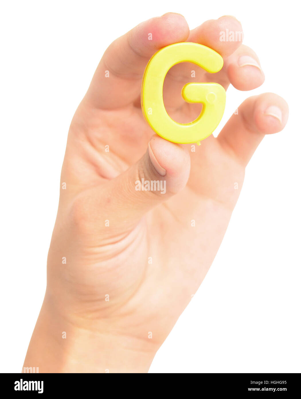 the letter G in a hand isolated on white background Stock Photo - Alamy