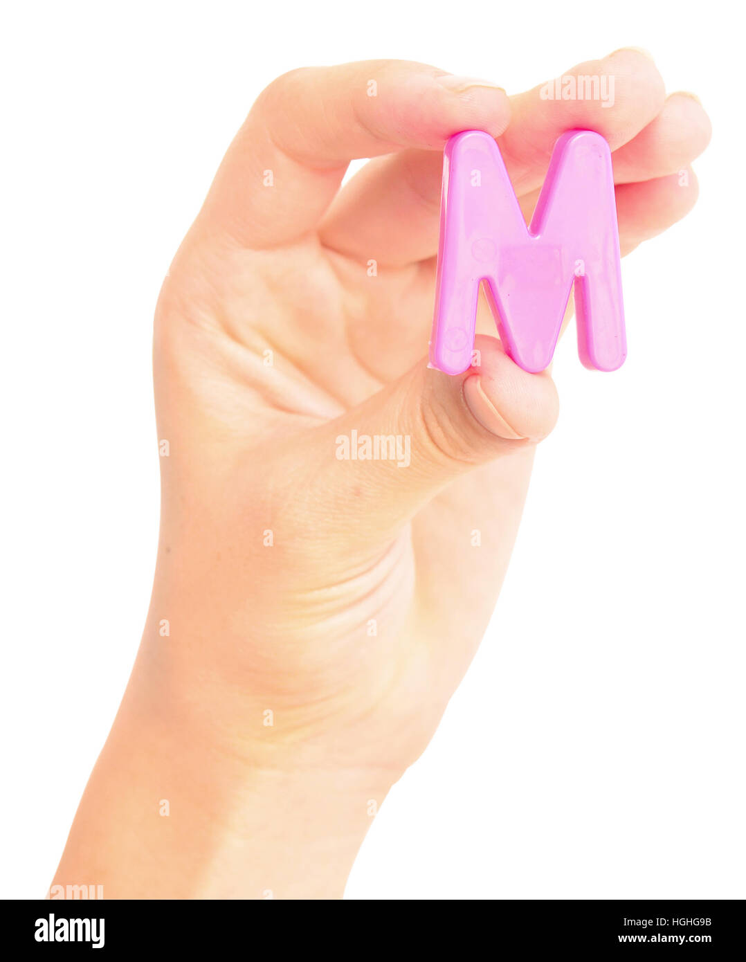 the letter M in a hand isolated on white background Stock Photo - Alamy