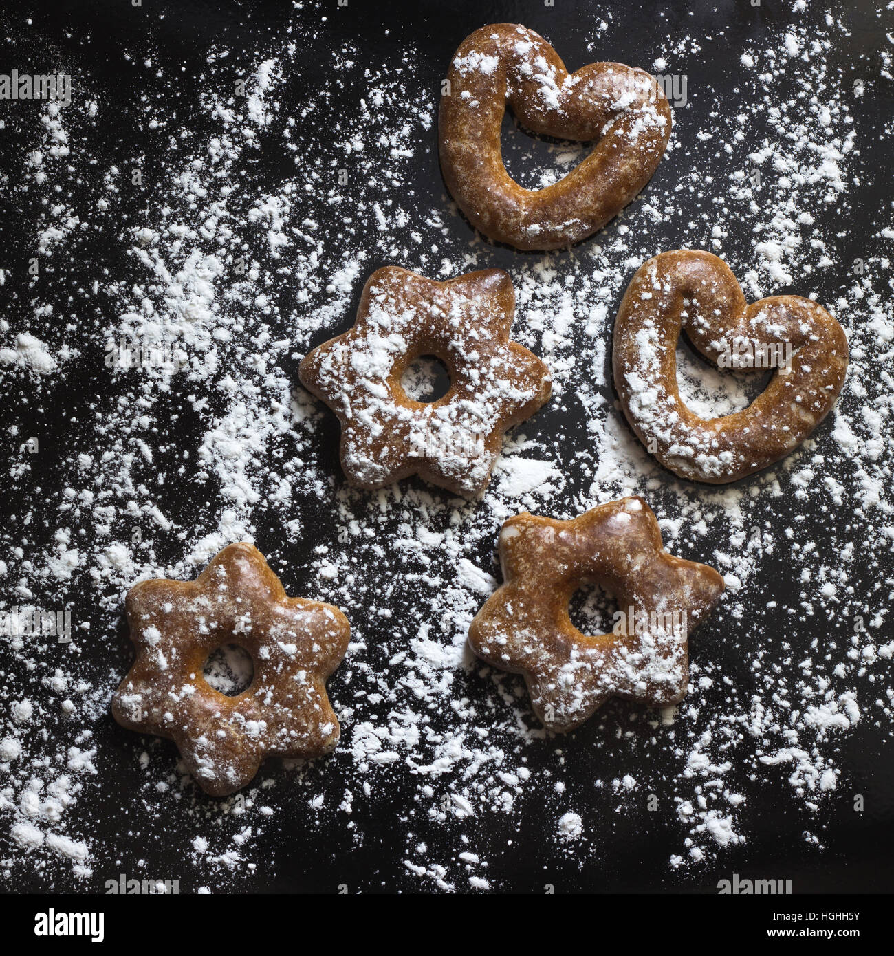 Bavarian gingerbread iced with sugar powder on black background Stock ...