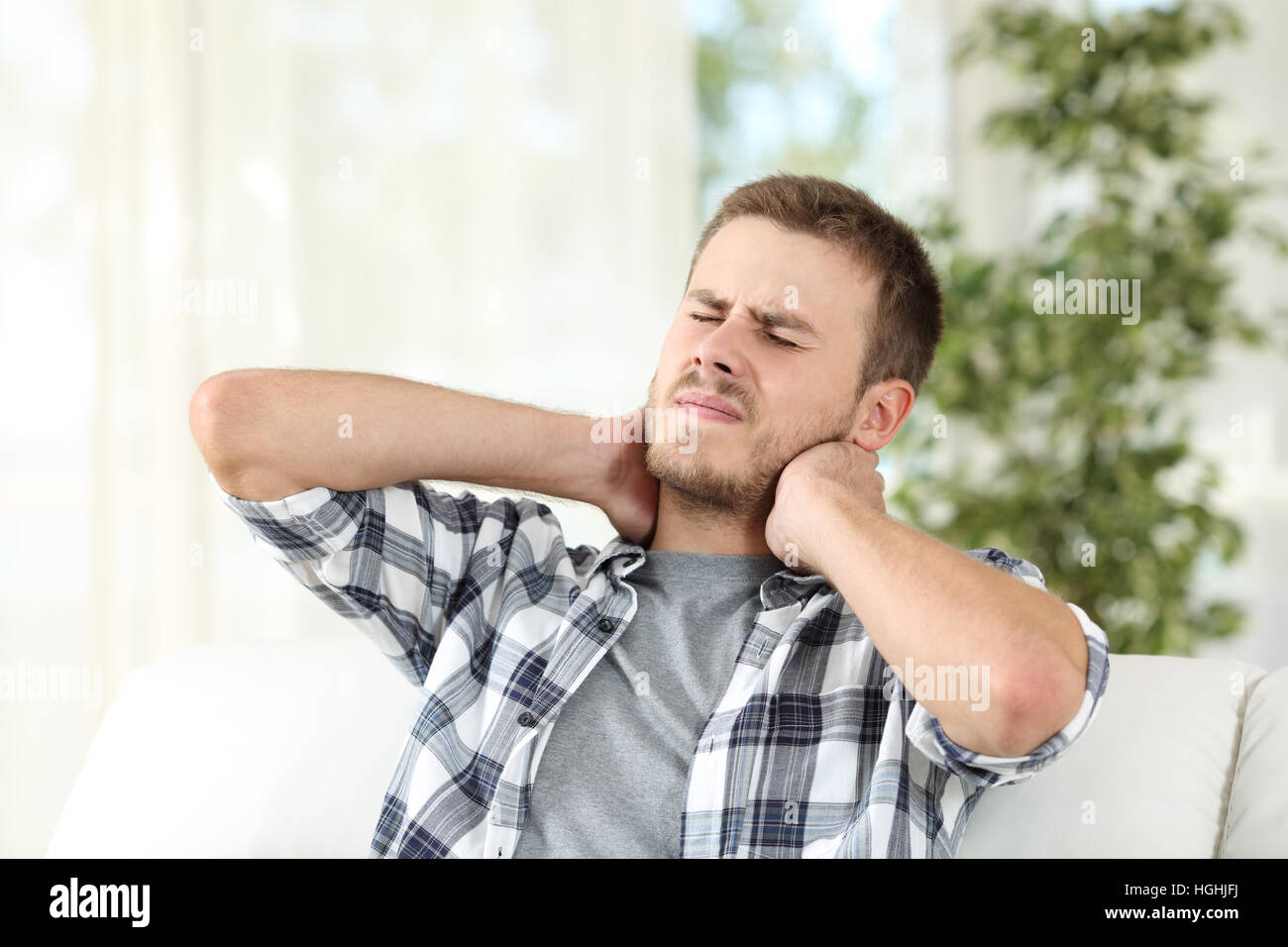 Uncomfortable man sitting hi-res stock photography and images - Alamy