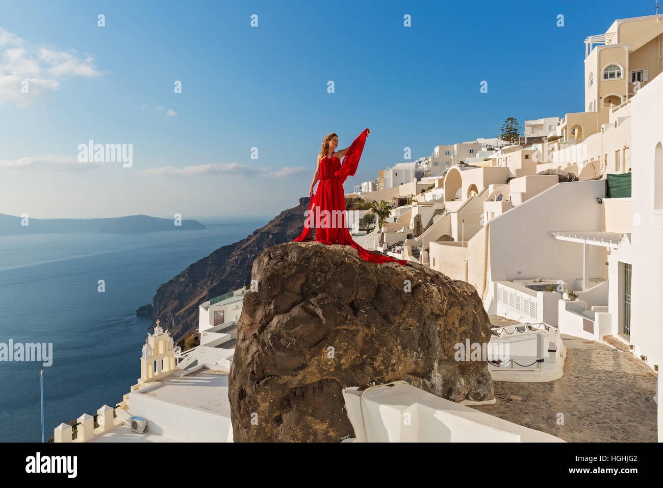 Woman stands on high cliff hi-res stock photography and images - Alamy
