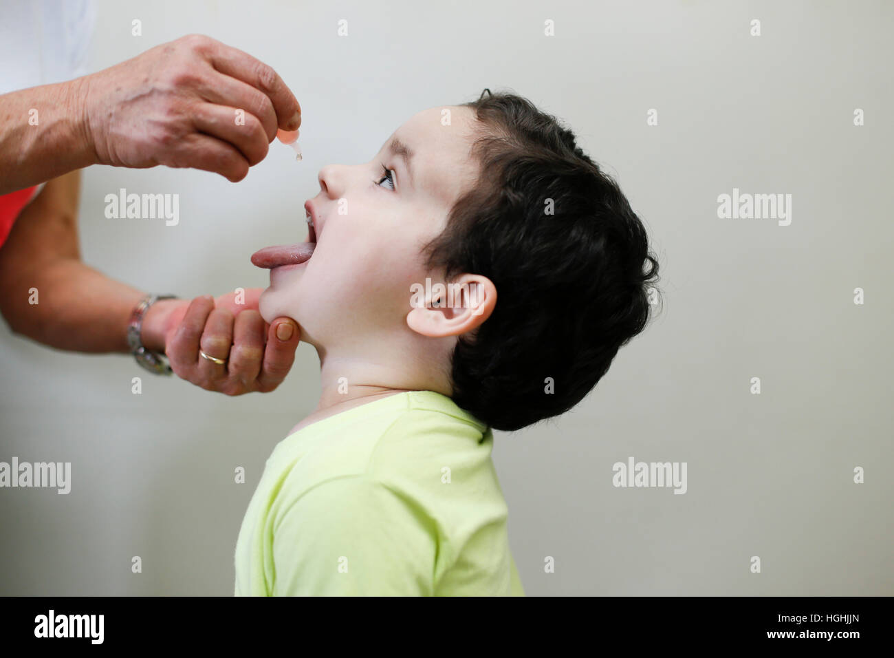 Childhood immunization action with little drop in clinic Stock Photo ...