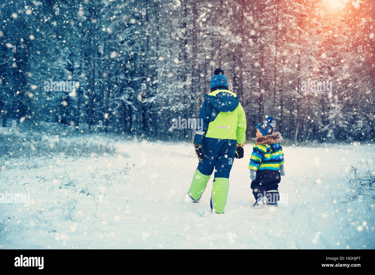 Children playing in snow at snowfall Stock Photo - Alamy