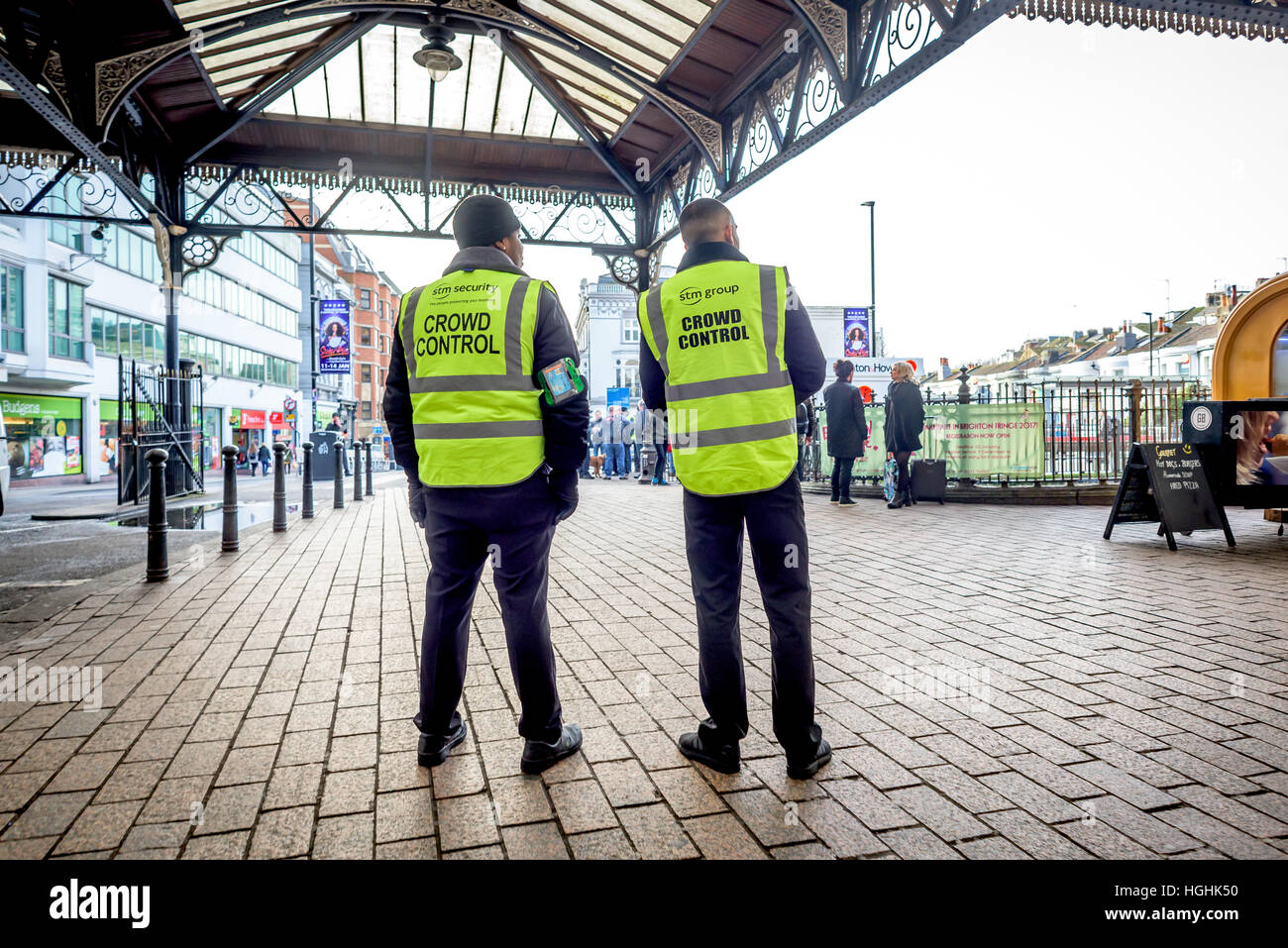 Crowd control operatives at Brighton Station this morning, as drivers ...