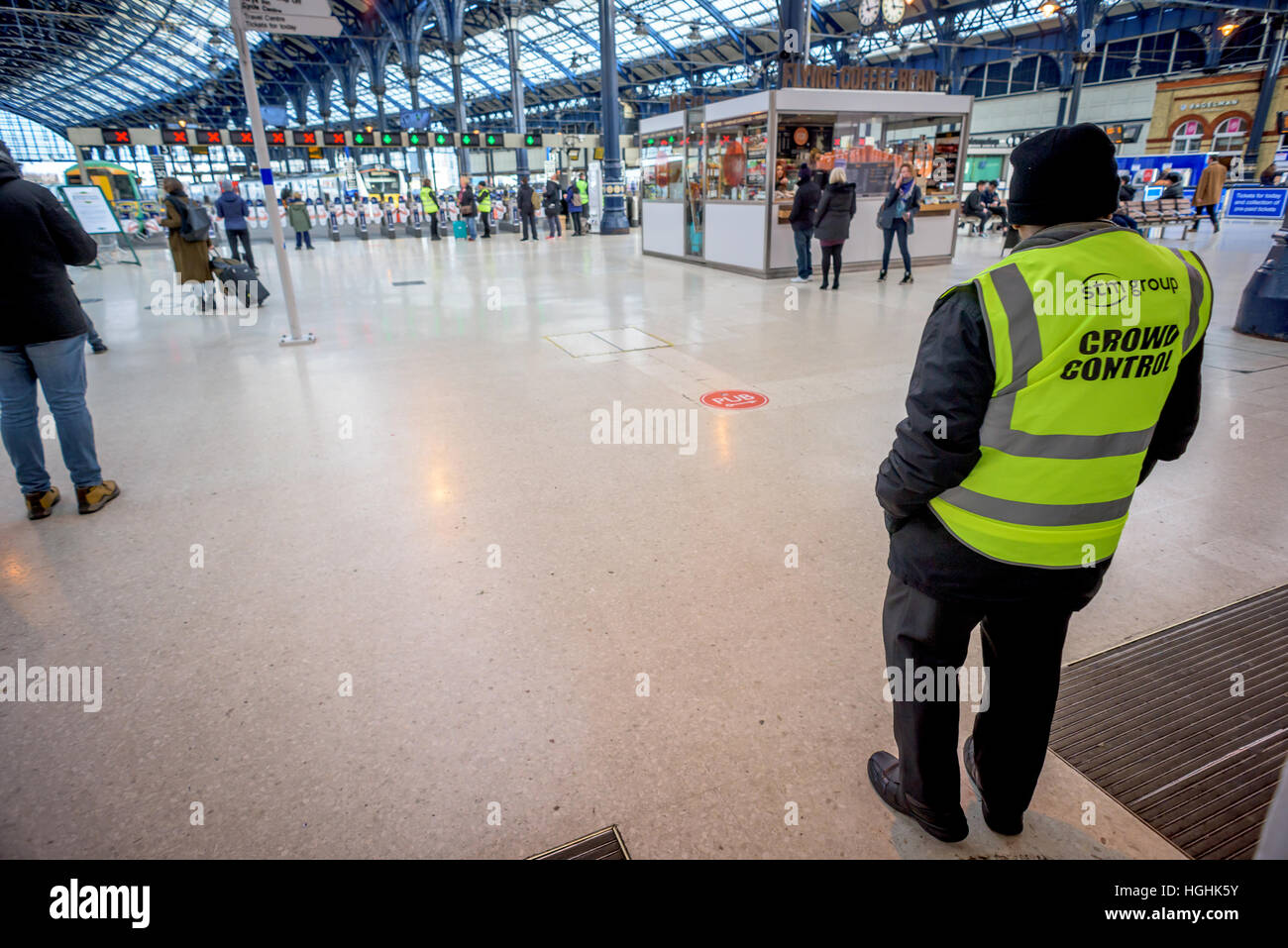 Crowd control operatives at Brighton Station this morning, as drivers ...