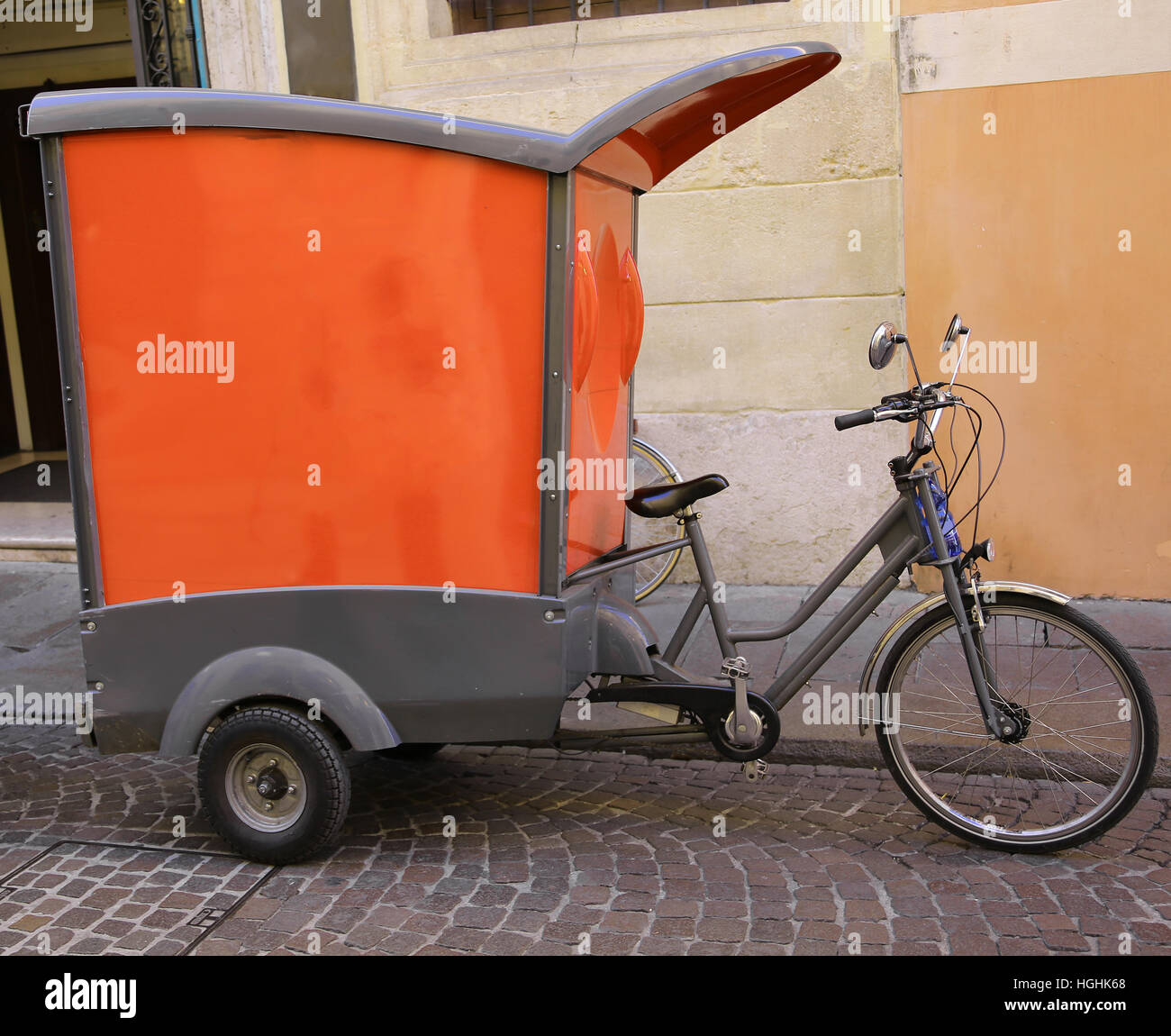vehicle with pedals type bicycle of a Express courier and truck load ...