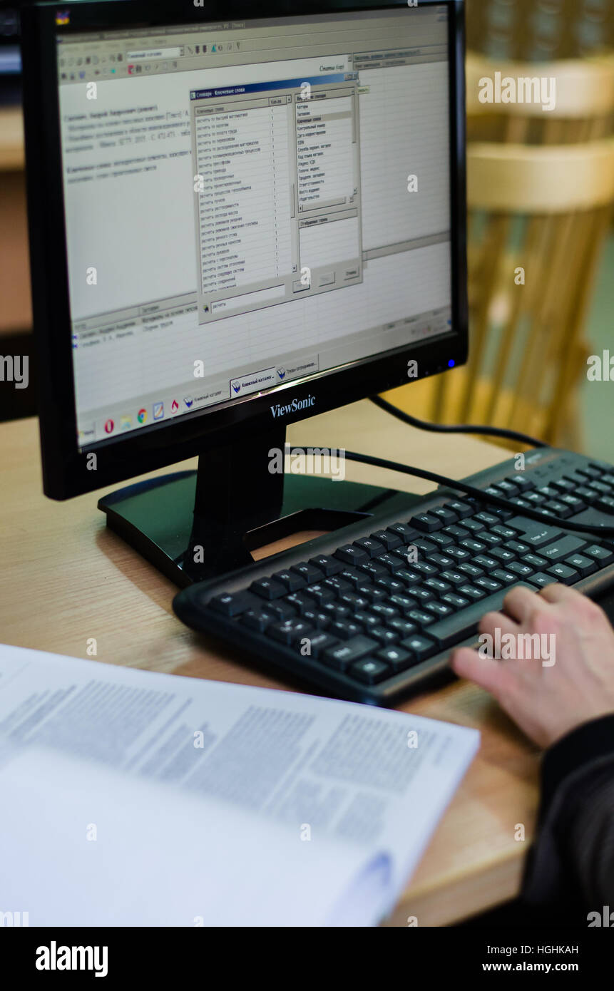 Day in library with books, student, librarians, computers and laptops ...