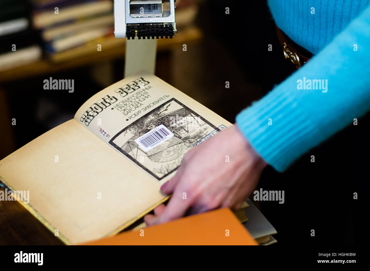 Applying sticker hi-res stock photography and images - Alamy