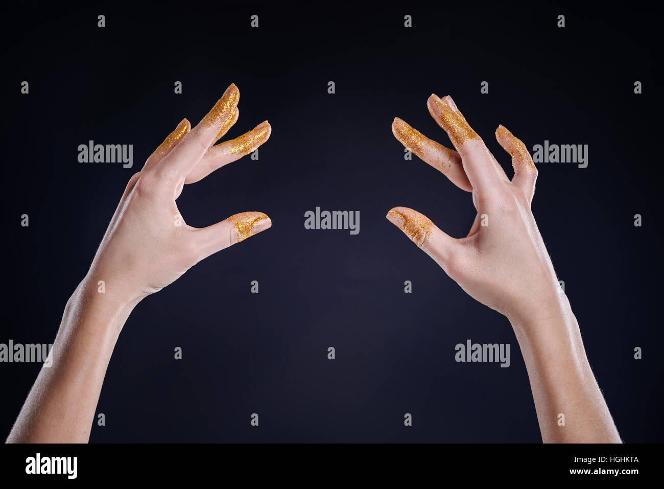 Graceful hands gesturing on black background Stock Photo - Alamy