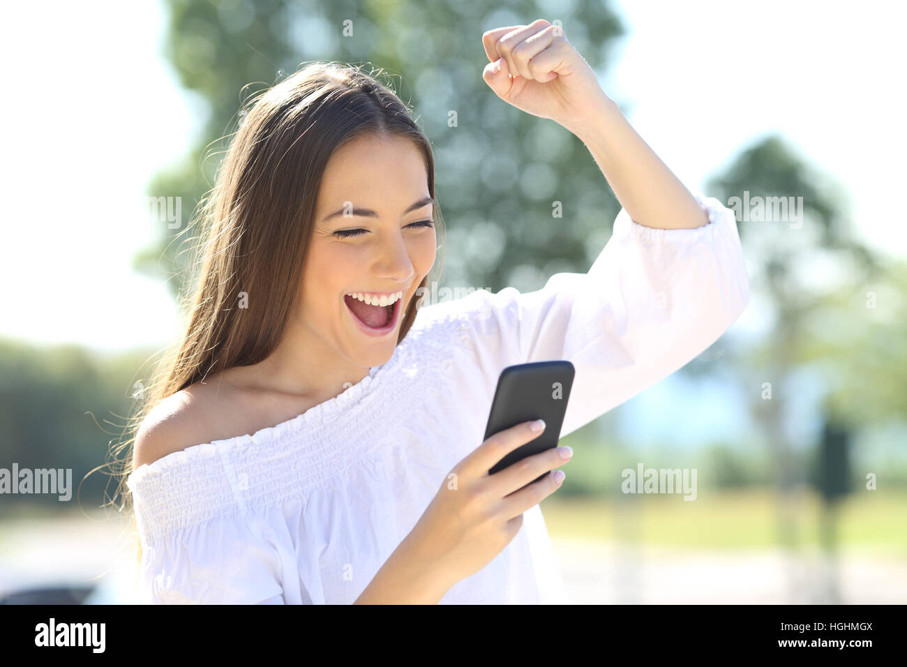 Mobile happy hi-res stock photography and images - Alamy