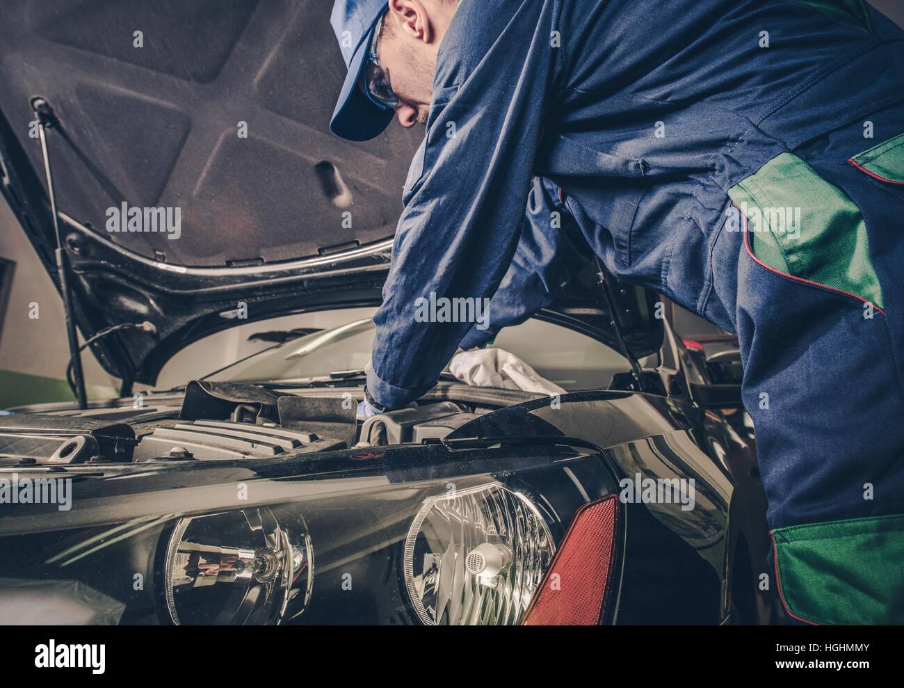 Auto Service Business Concept. Pro Car Mechanic Taking Care of Vehicle ...