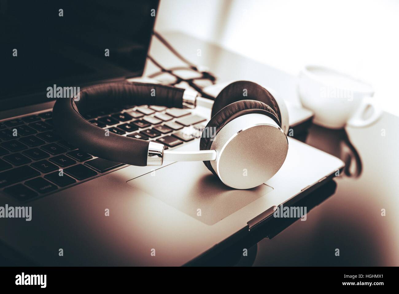 Modern Mobile Computer Station. Modern Laptop and Wireless Headphones ...