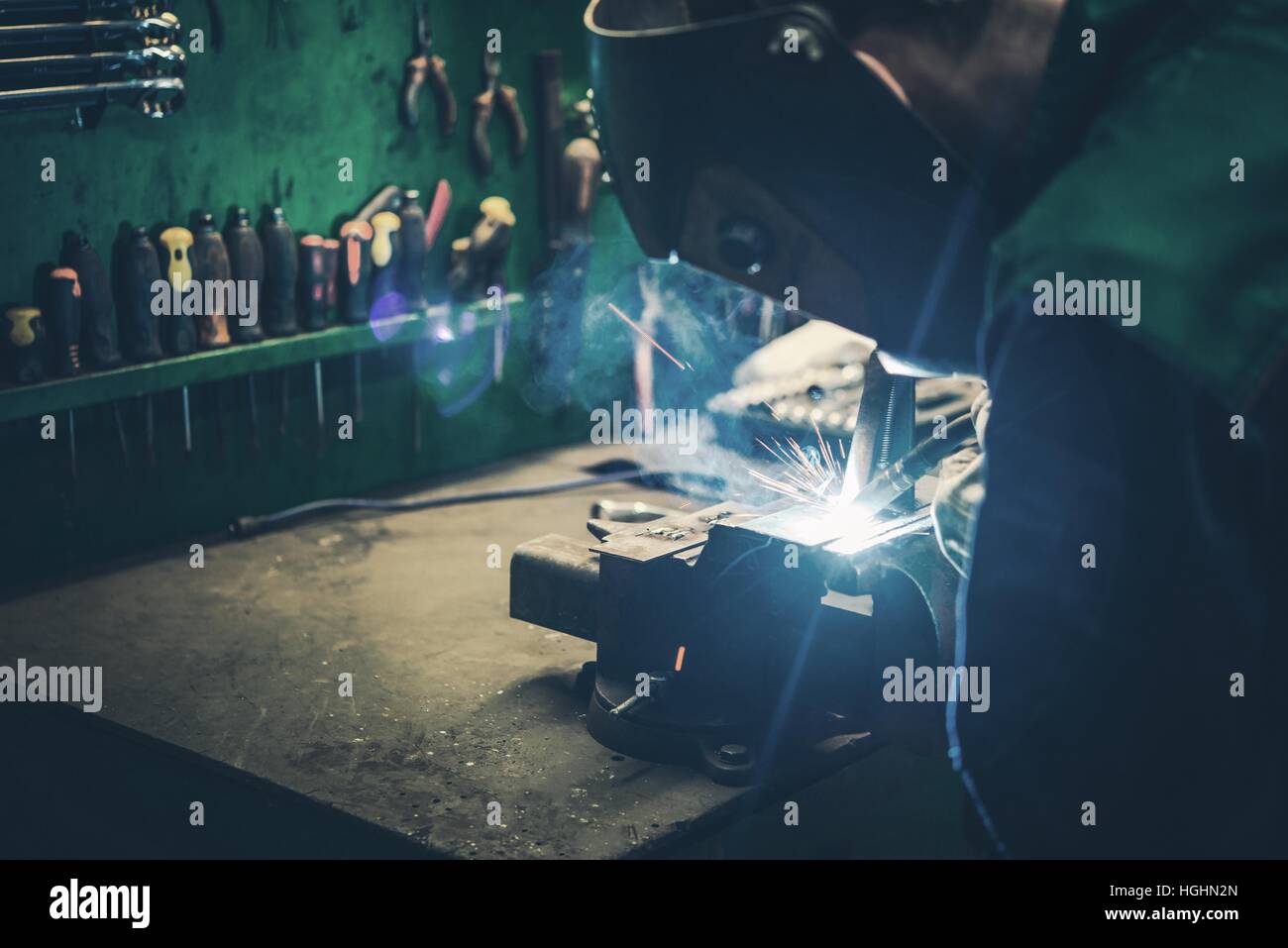 Welder Fusing Metal Together. Welding Metal Parts in the Small Workshop ...