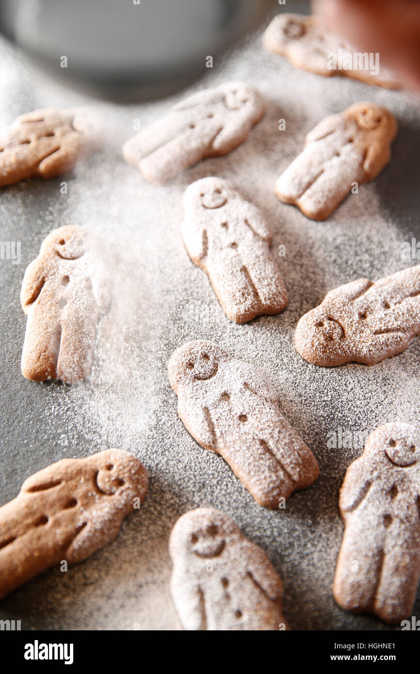 gingerbread man being dusted with icing sugar Stock Photo - Alamy