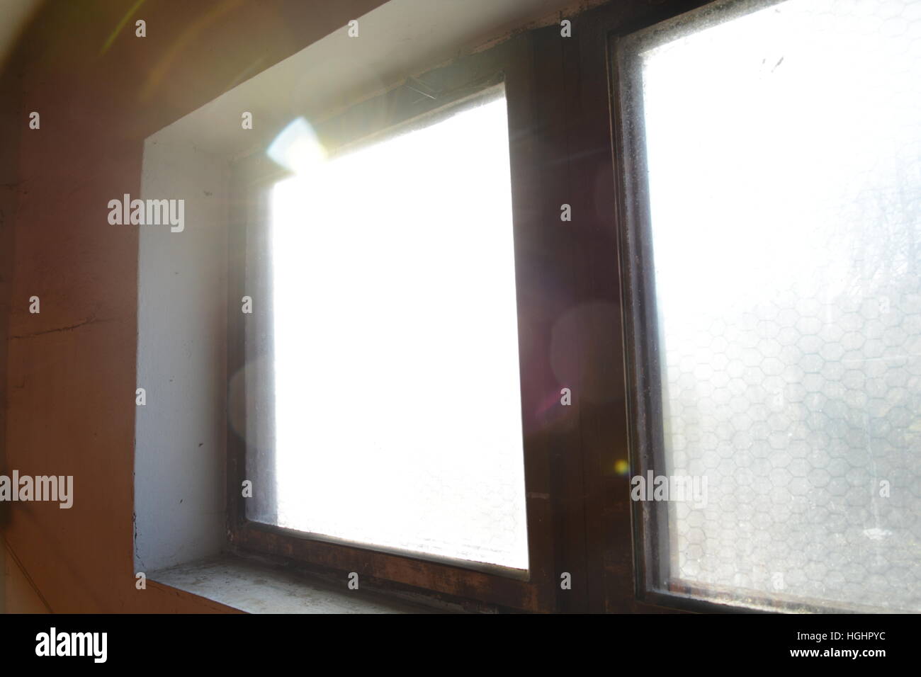 sunrays going through the window during picturesque sunset Stock Photo ...