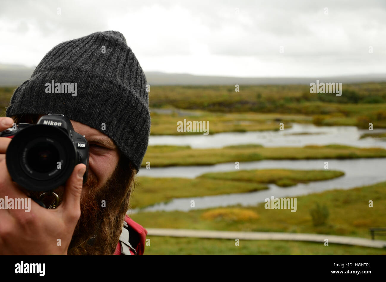 A photographer looks through the camera lens Stock Photo - Alamy