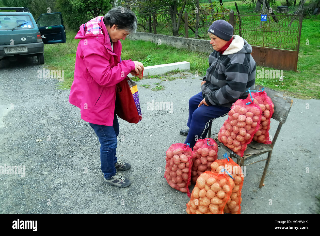 Maramures, an isolated Carpathian region of Romania. A tourist buying ...