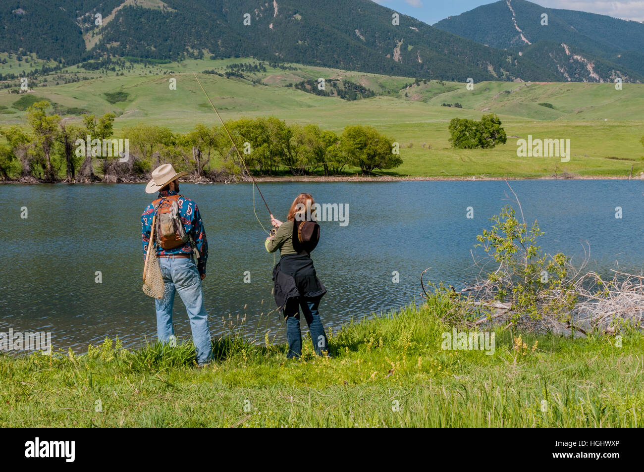 USA, Wyoming, Wolf, Eaton Ranch fishing on the pond Stock Photo - Alamy