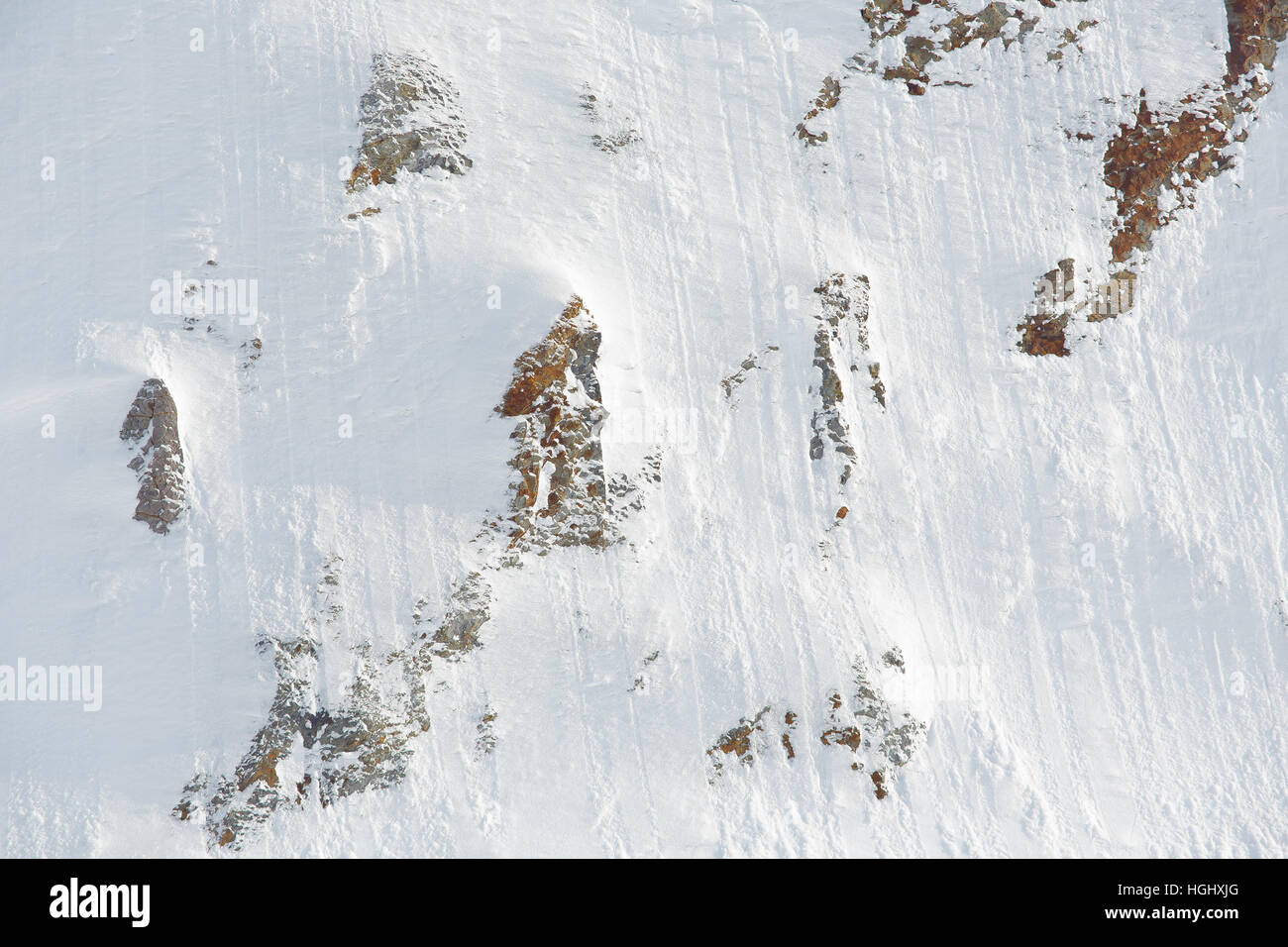 Rocks covered with snow outdoor Stock Photo - Alamy