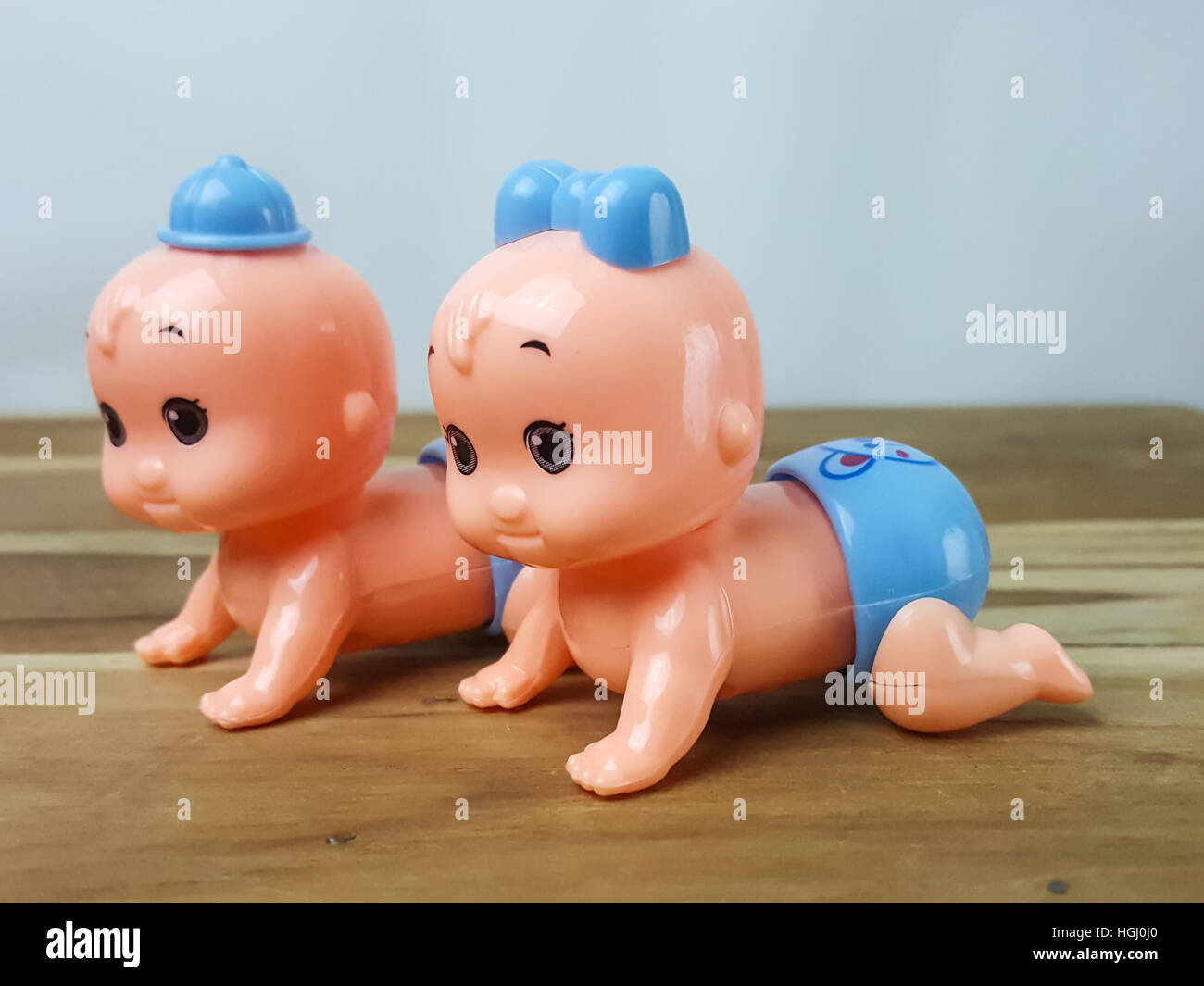 Mechanical wind up crawling baby toy on wood background Stock Photo - Alamy