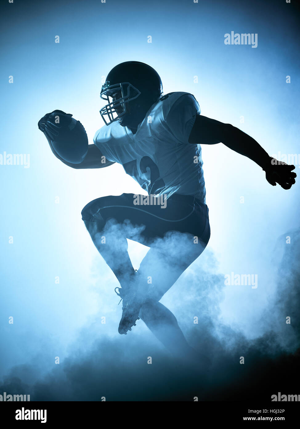 one american football player portrait in silhouette shadow on white ...
