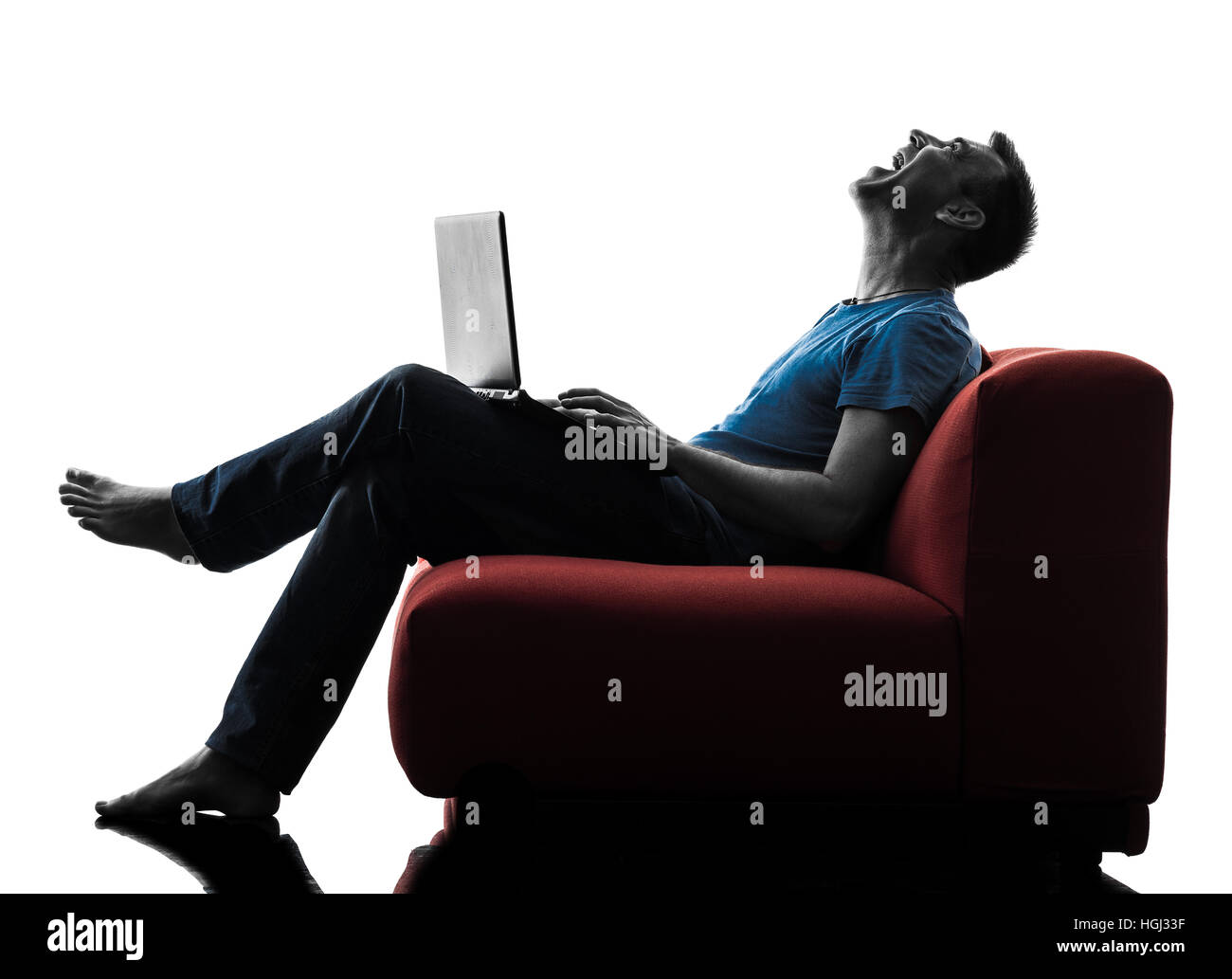 one caucasian man Laughing computer computing laptop in silhouette ...