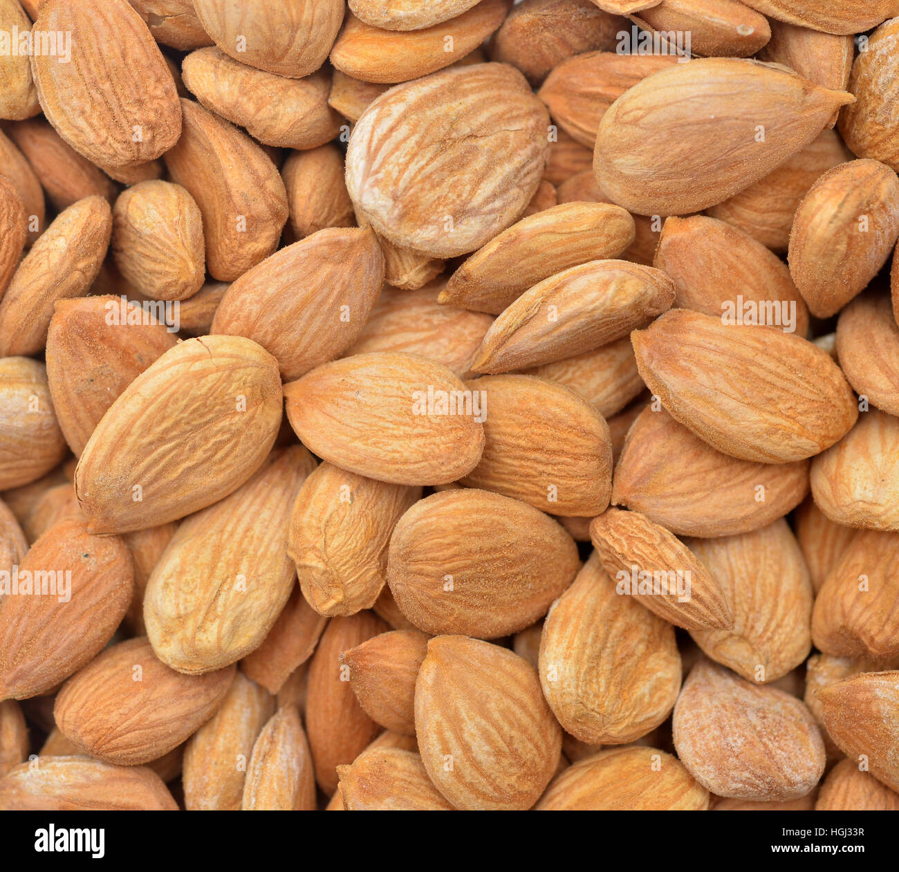 Almonds close-up background Stock Photo - Alamy