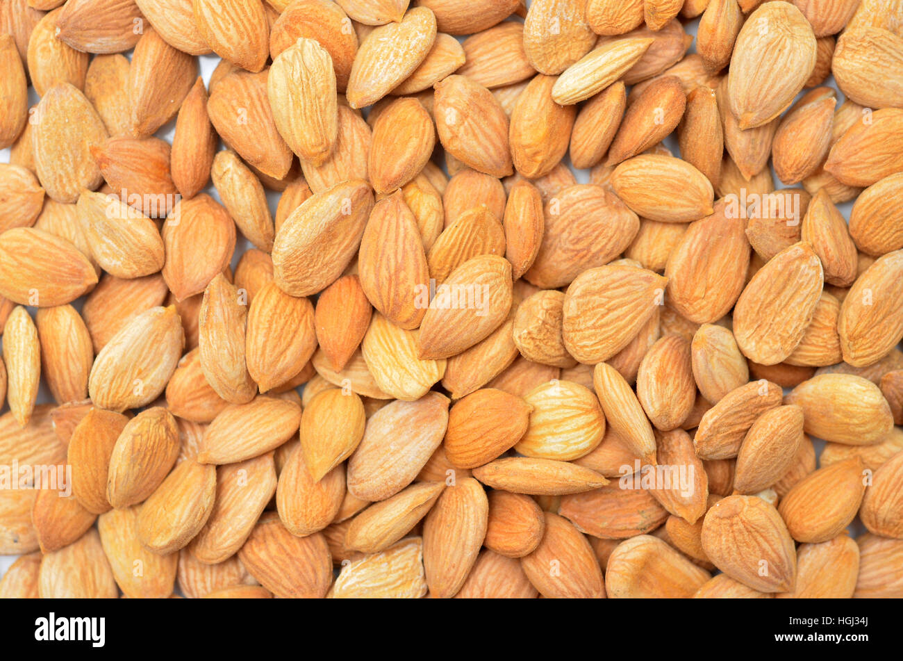 Almonds close-up background Stock Photo - Alamy