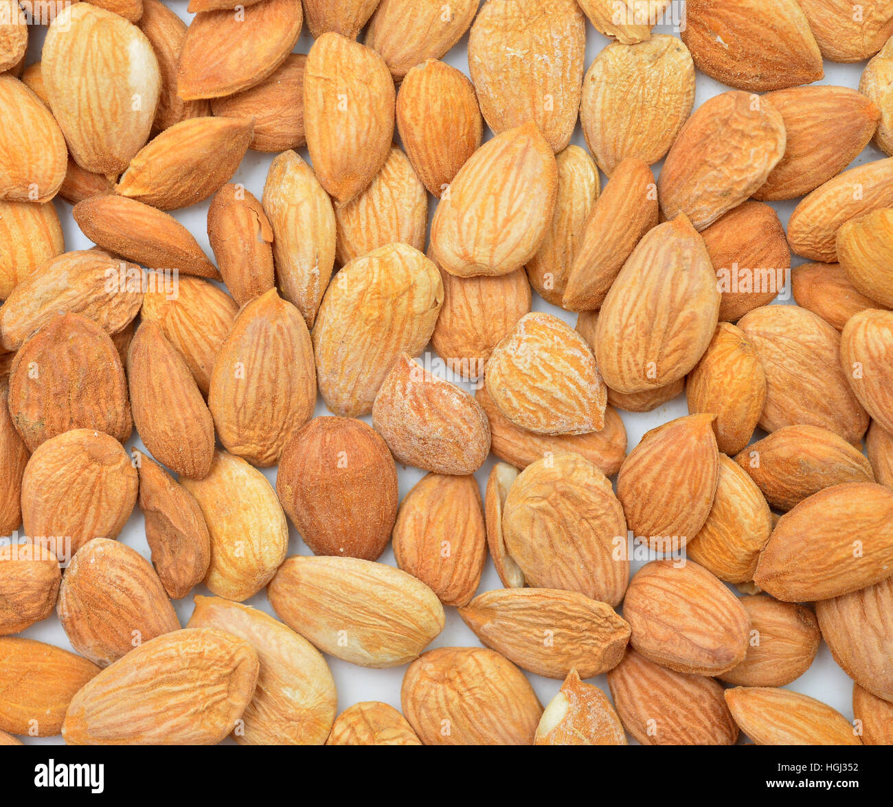 Almonds close-up background Stock Photo - Alamy