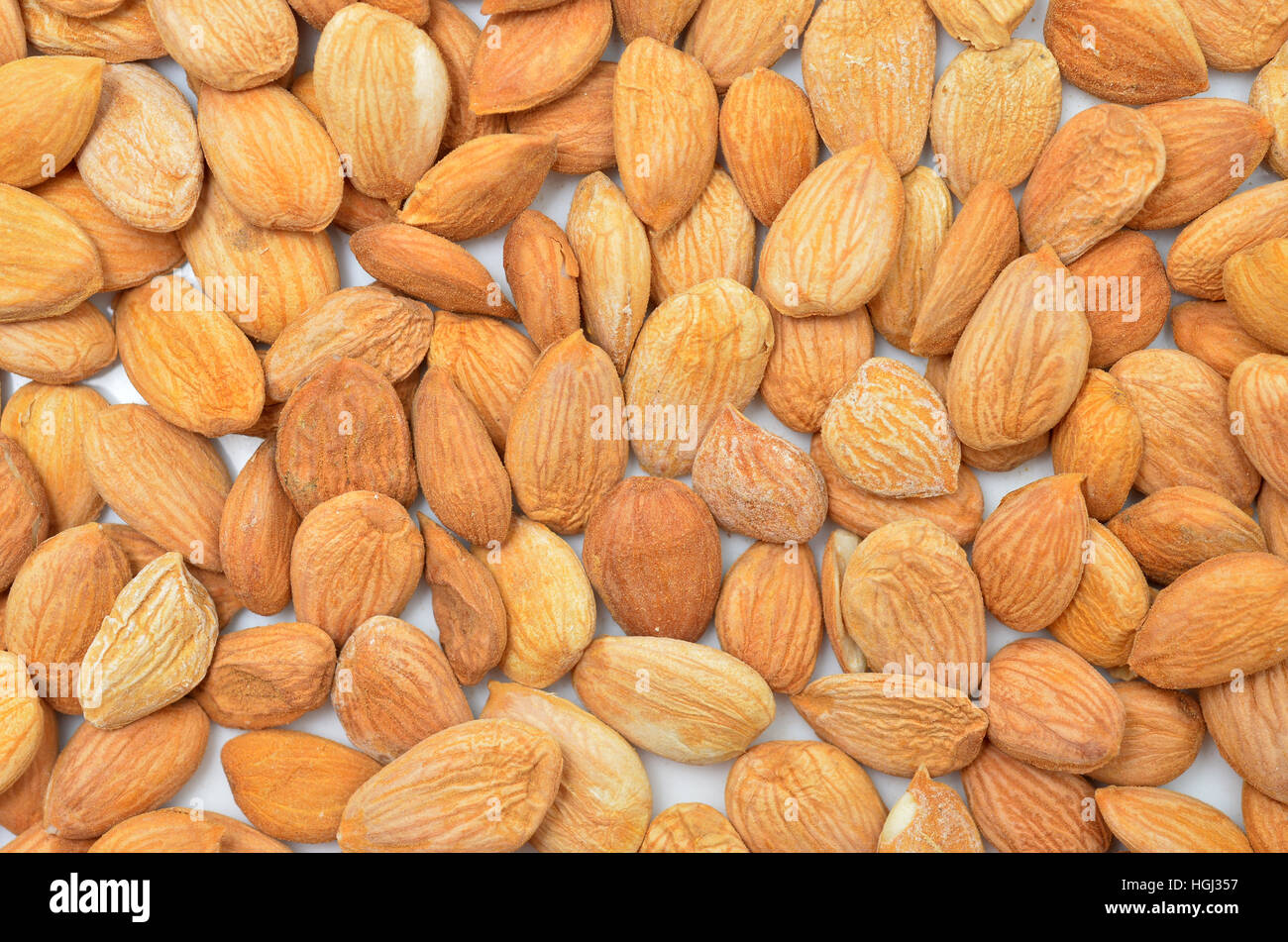 Almonds close-up background Stock Photo - Alamy