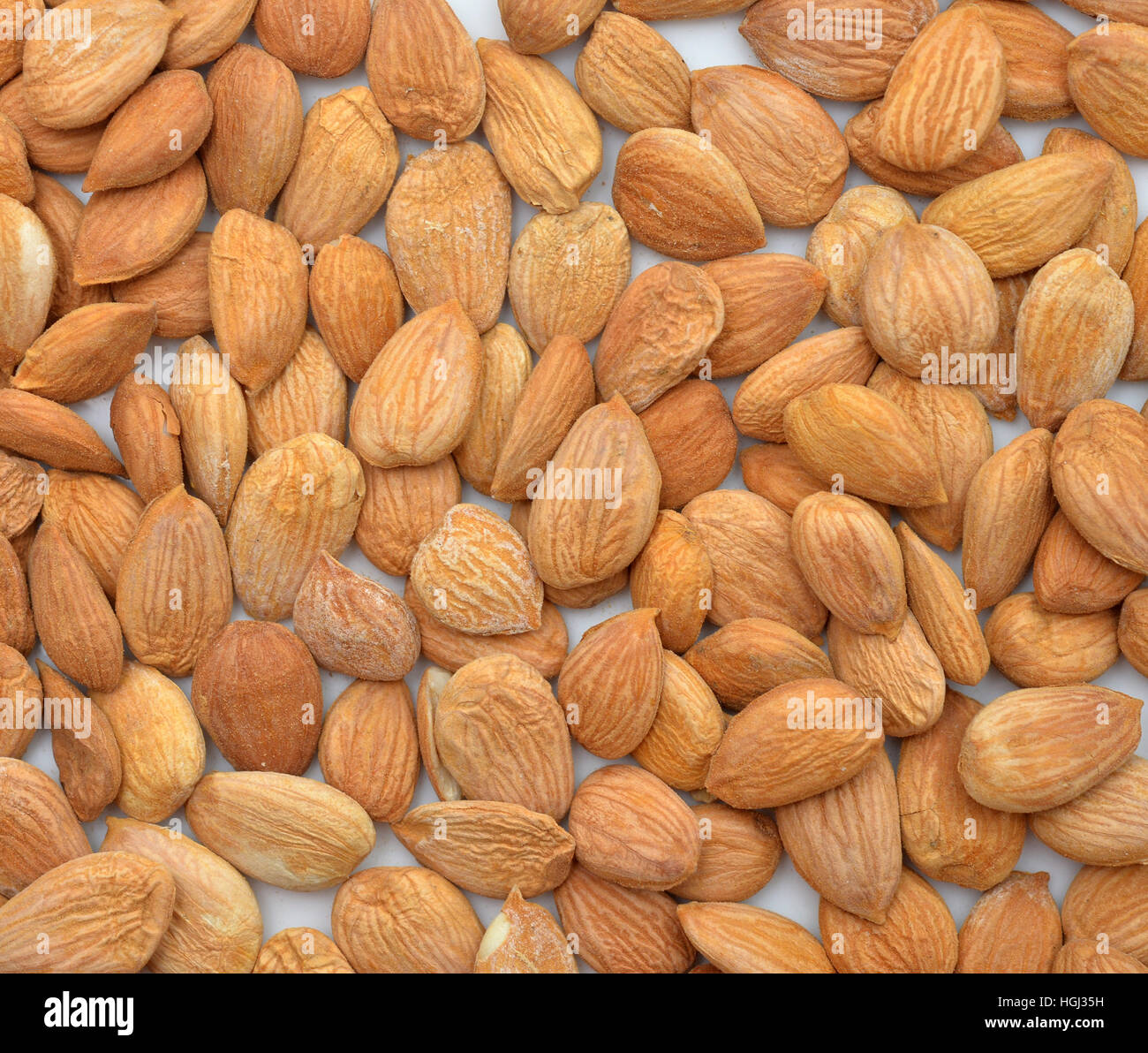 Almonds close-up background Stock Photo - Alamy