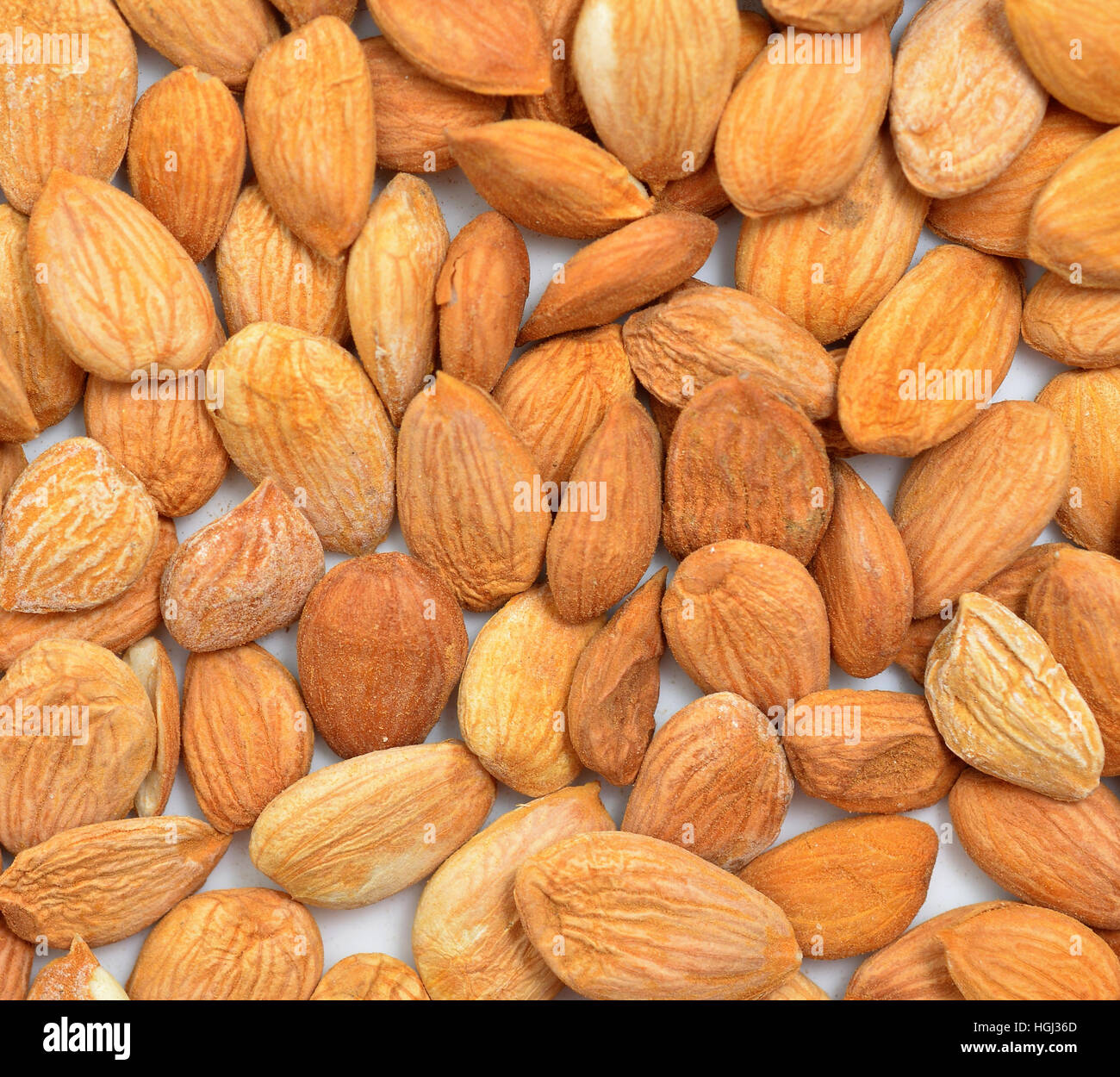 Almonds close-up background Stock Photo - Alamy