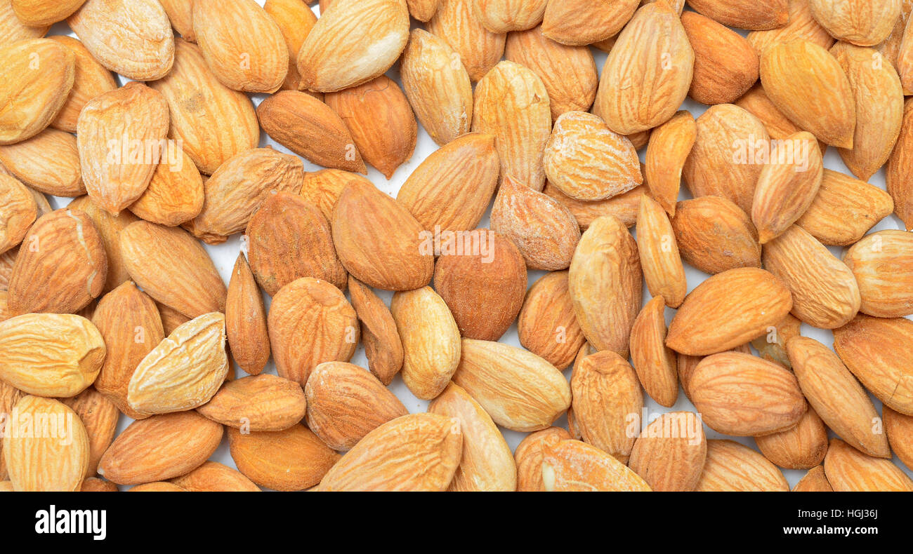 Almonds close-up background Stock Photo - Alamy