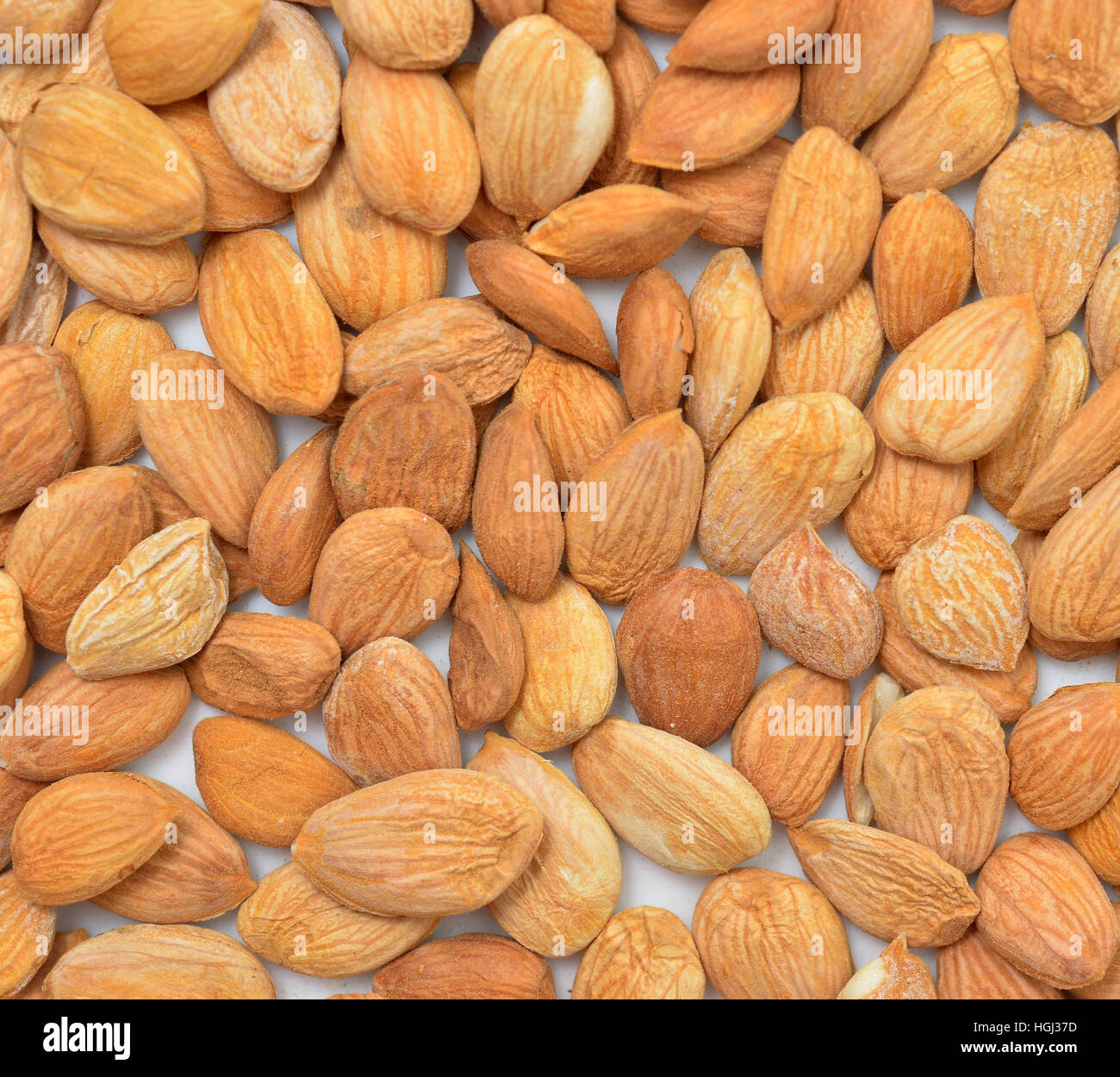 Almonds close-up background Stock Photo - Alamy